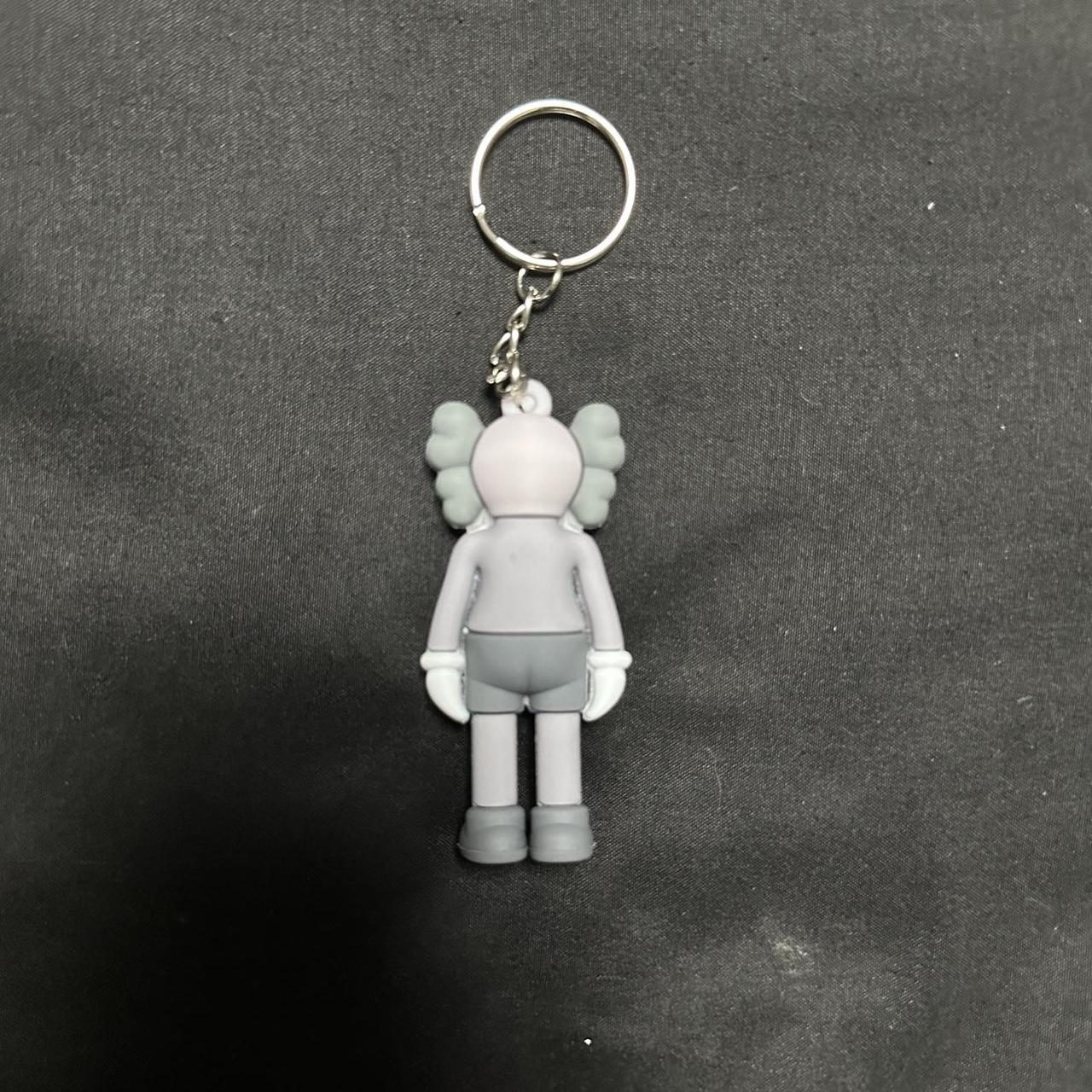 kaws keychain gray - Depop