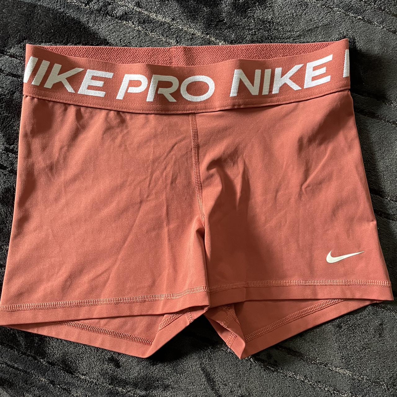 Pink/peach, green, and red NIKE PROS #gymwear... | Depop