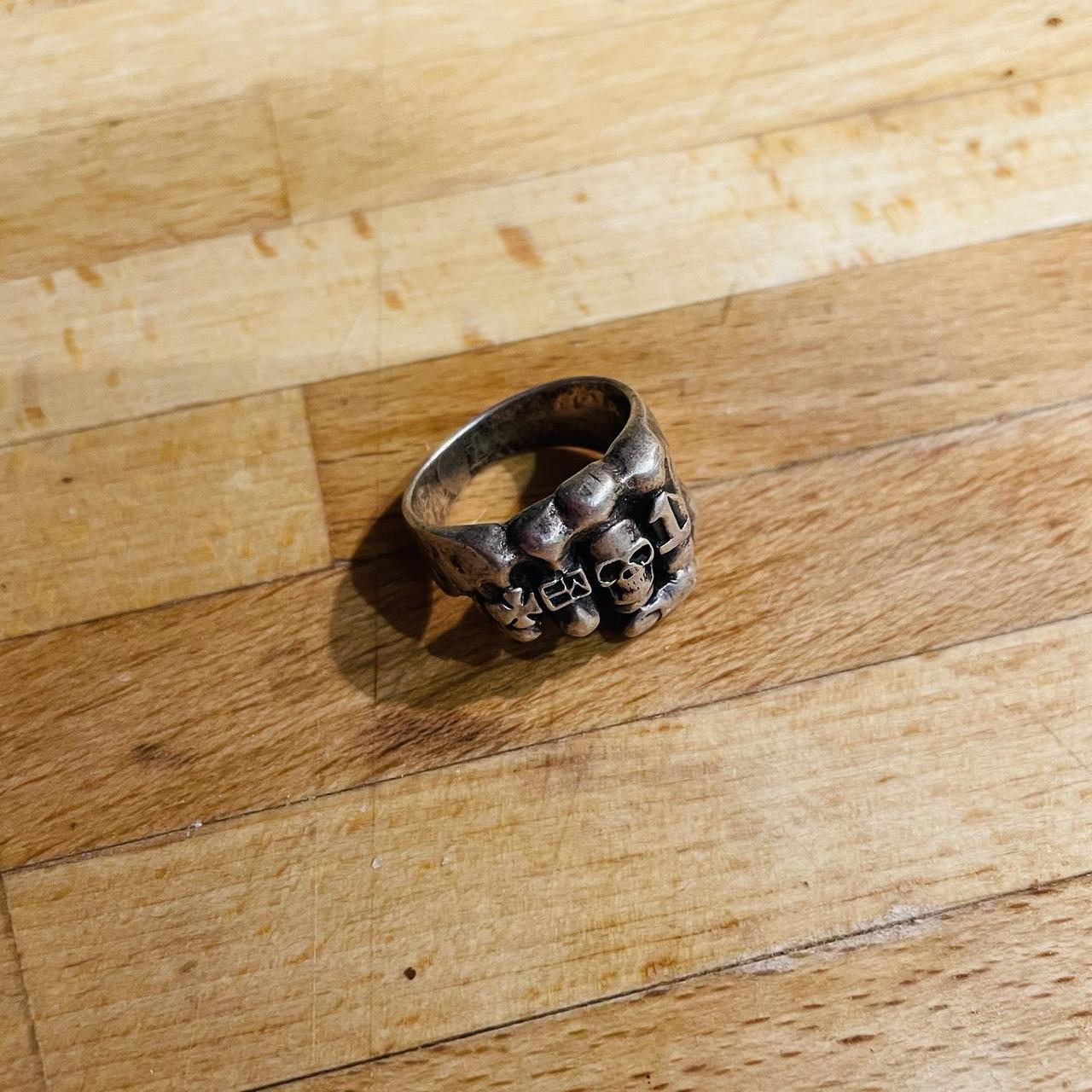 Silver coloured metal fist bump shaped ring with... - Depop