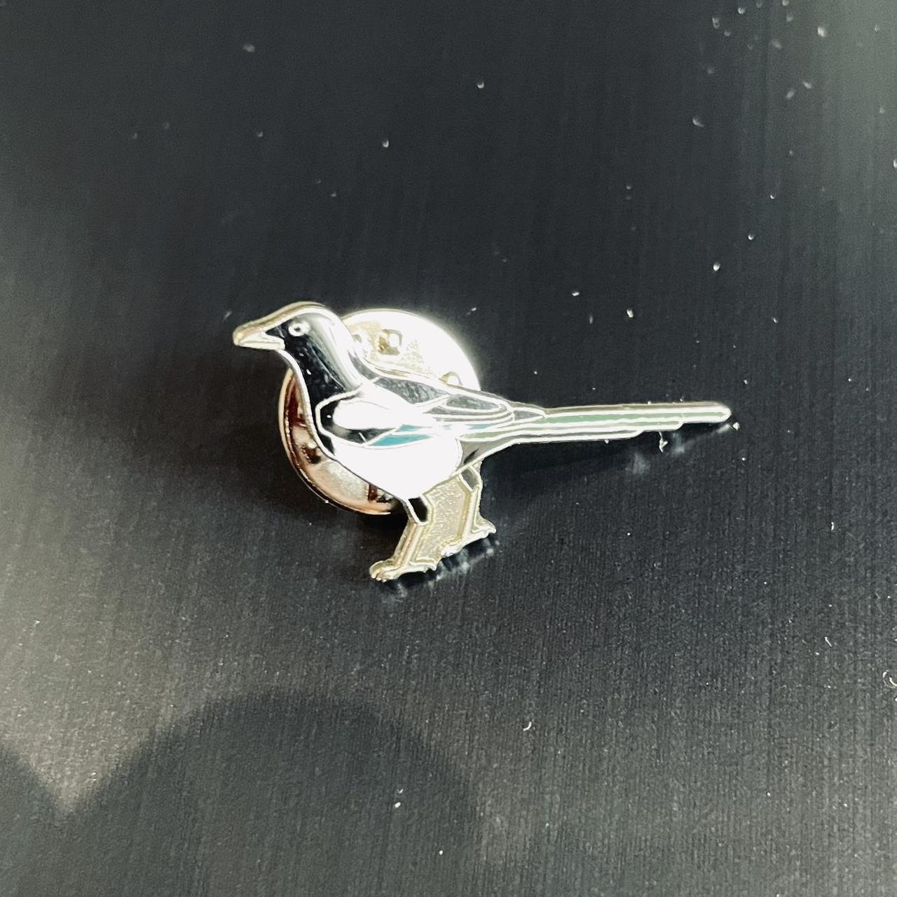 Black and white silvery magpie pin badge. 3cm x... - Depop