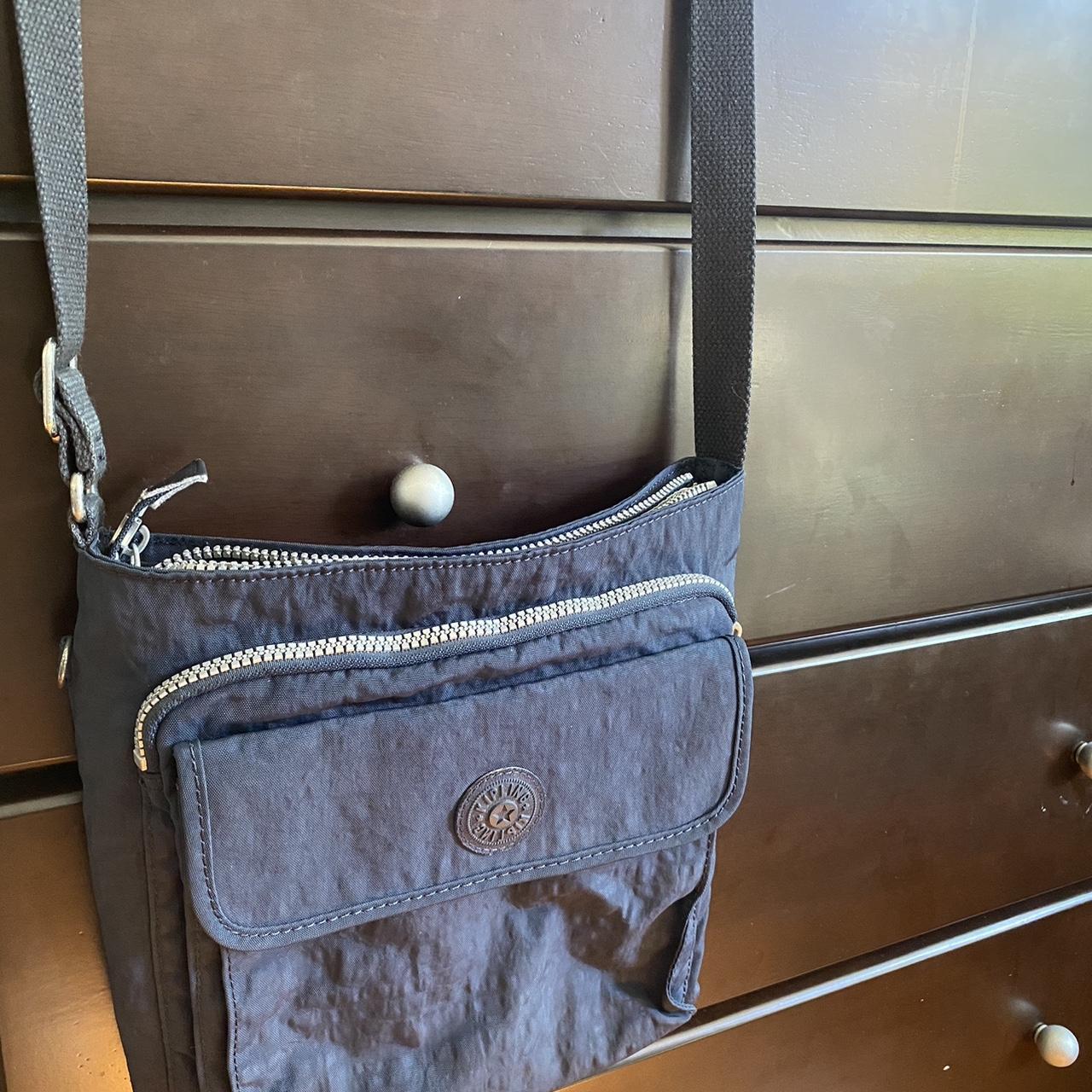 Navy Blue Kipling Crossbody bag. For size reference,... - Depop