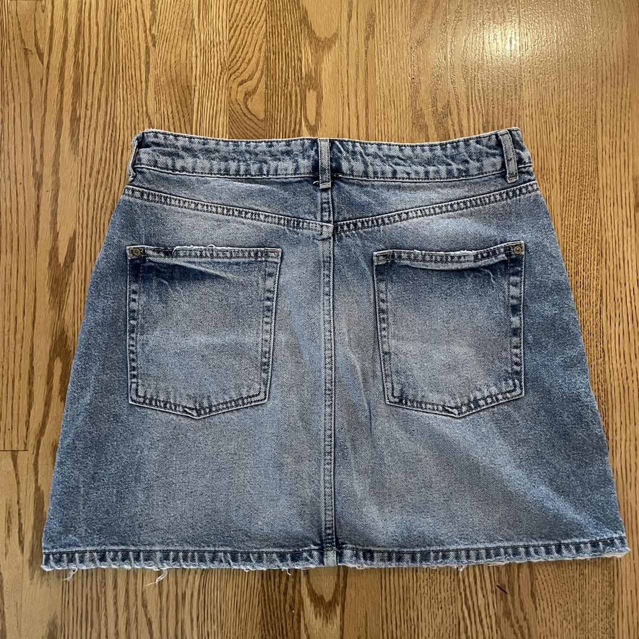 Medium demin skirt with flower embroidery on front... - Depop