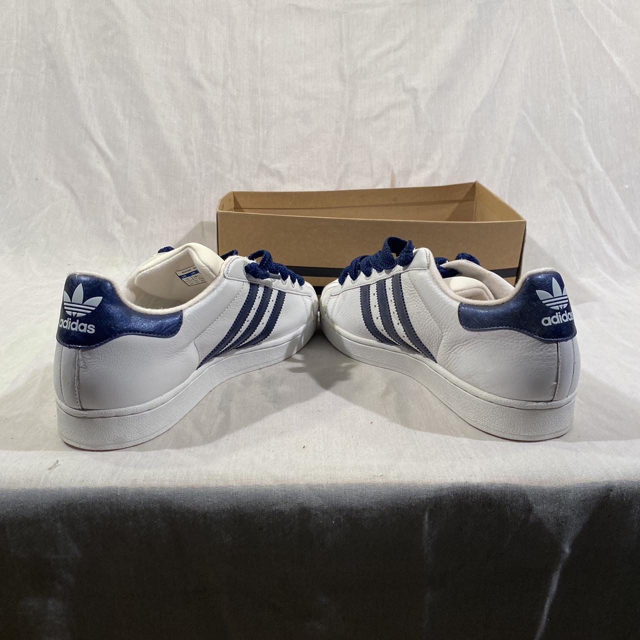 Worn twice metallic navy blue shell toes. #adidas... - Depop