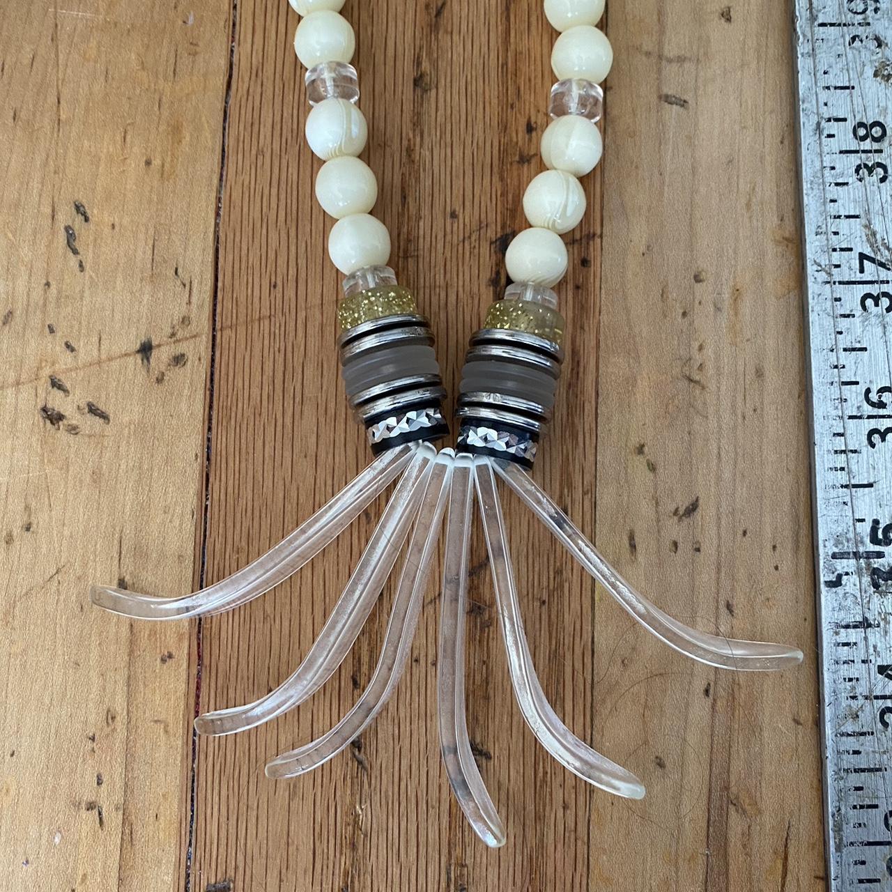 White & translucent vintage necklace. Some gold... - Depop