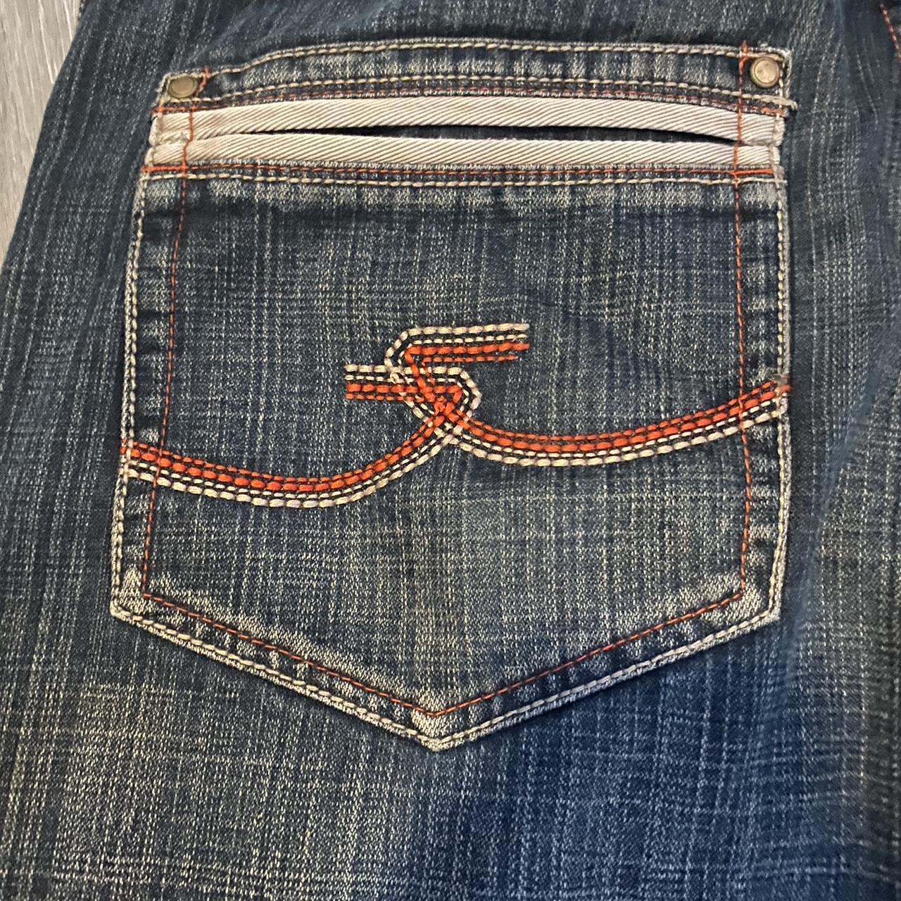 Basic Code dark blue with orange stitching baggy... | Depop