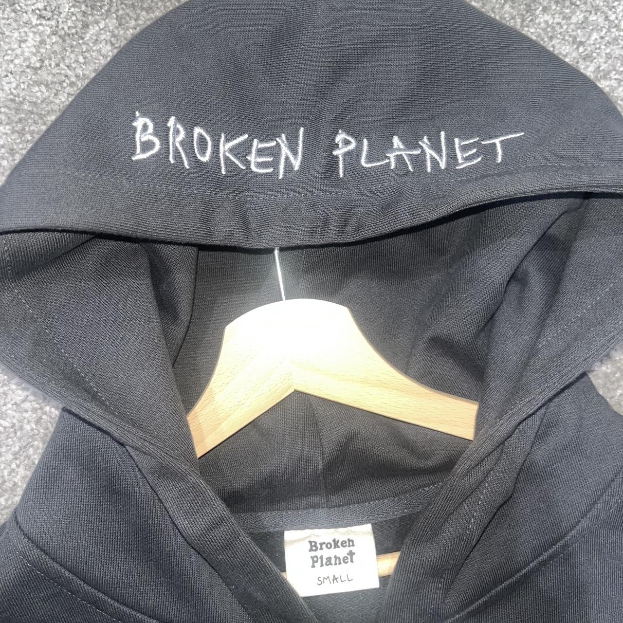 Broken planet zip up hoodie Soot black Can prove... - Depop