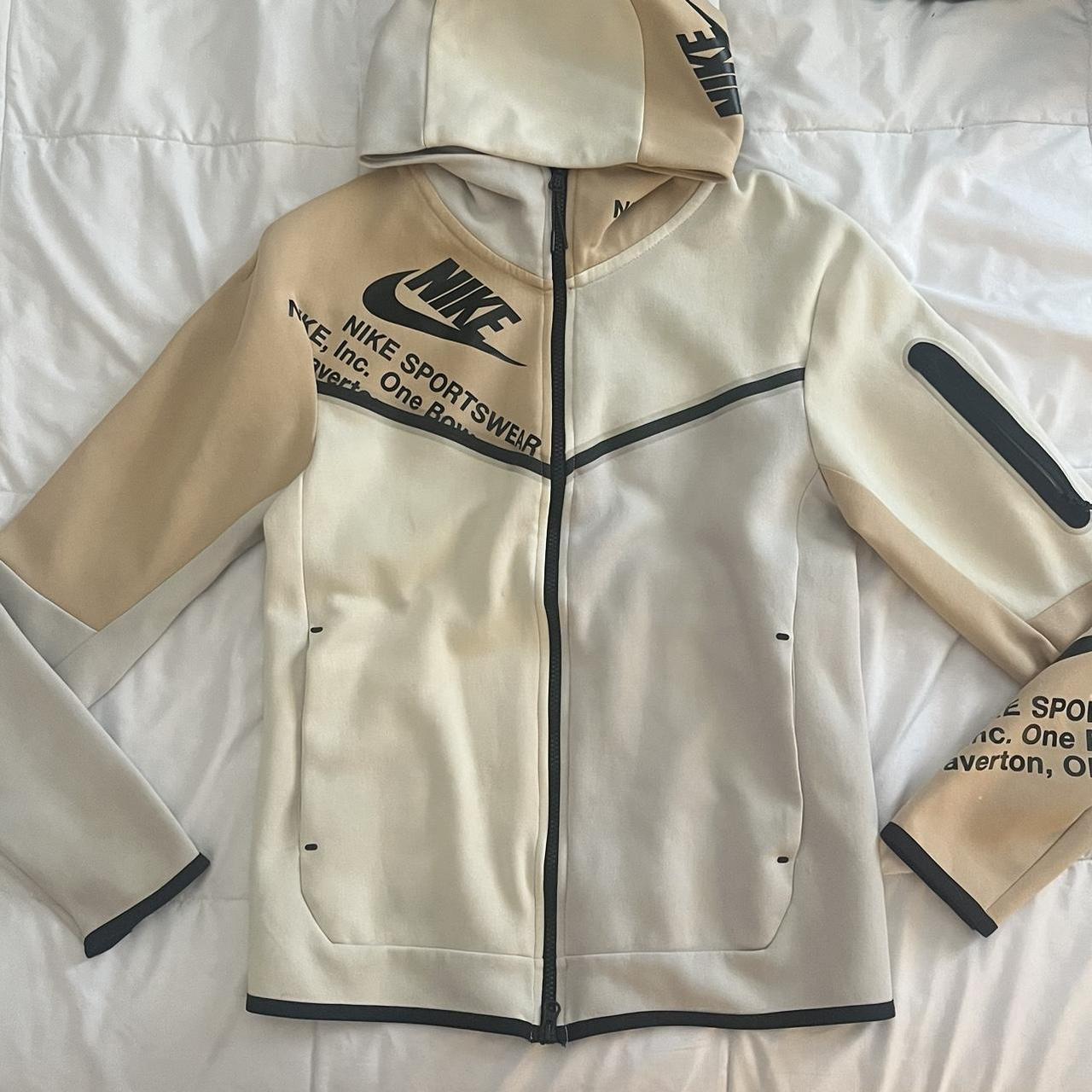 Small Tan Sportswear nike tech, has a few bleach... - Depop