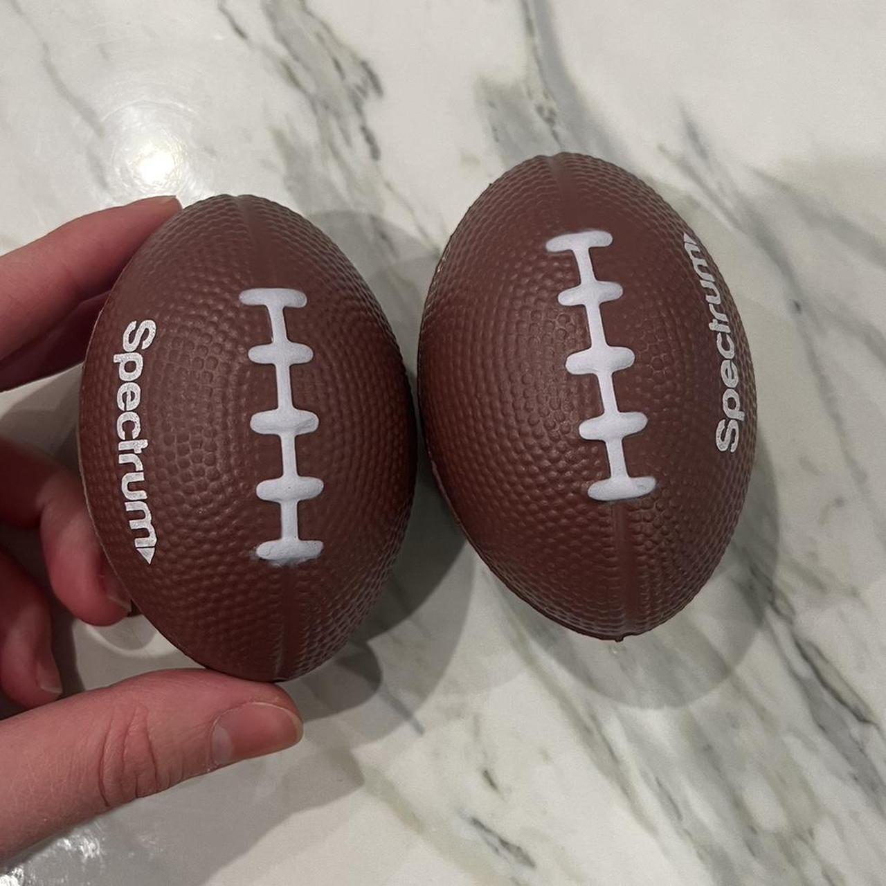 2 new football squishy stress balls, say spectrum on... - Depop