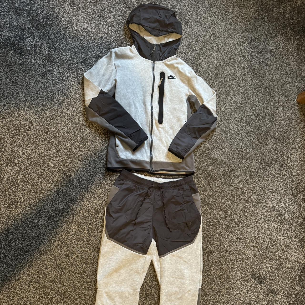 Grey and black deadstock Nike woven tech fleece 9/10... - Depop