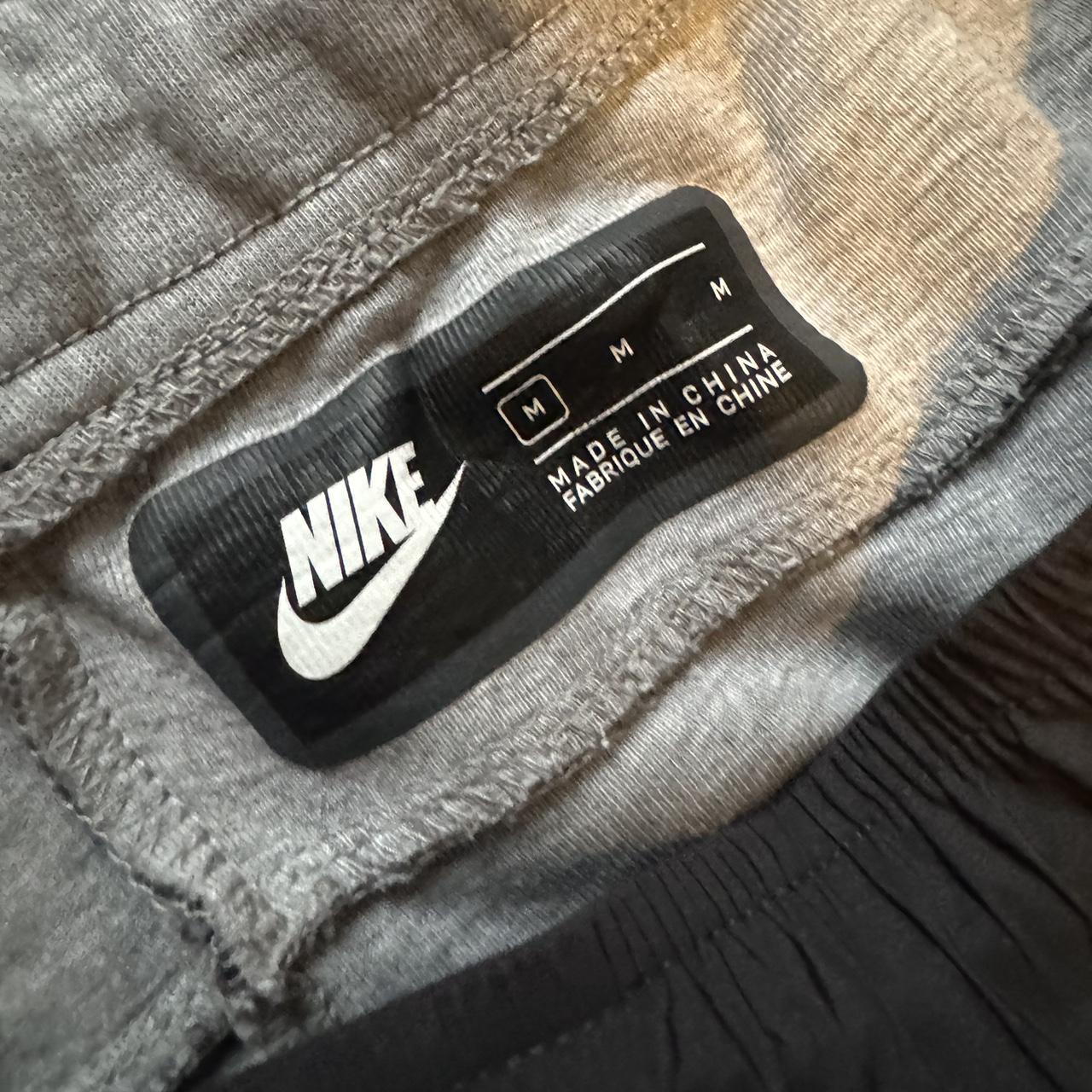 Grey and black deadstock Nike woven tech fleece 9/10... - Depop