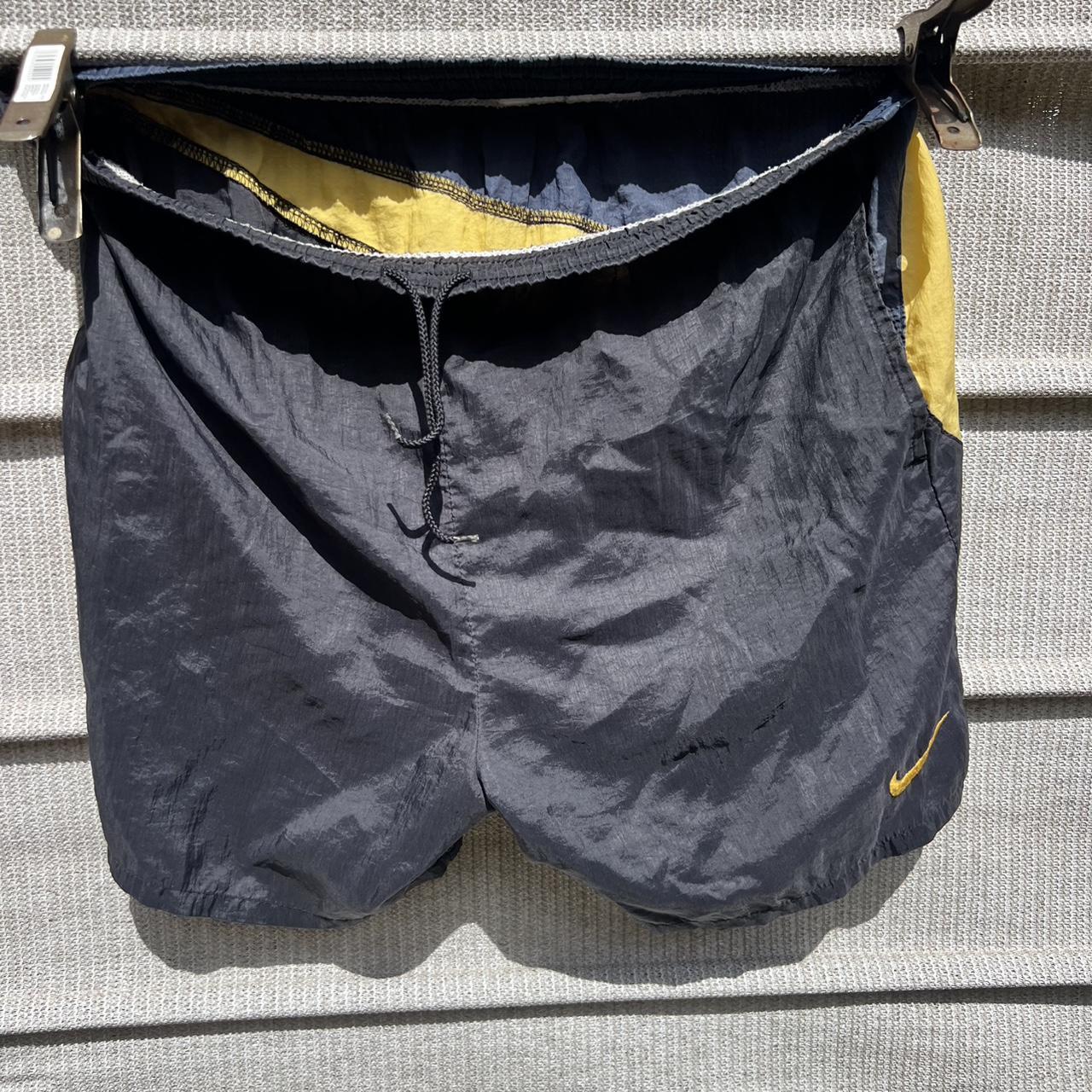 Nike black and yellow track shorts sportswear swim... | Depop