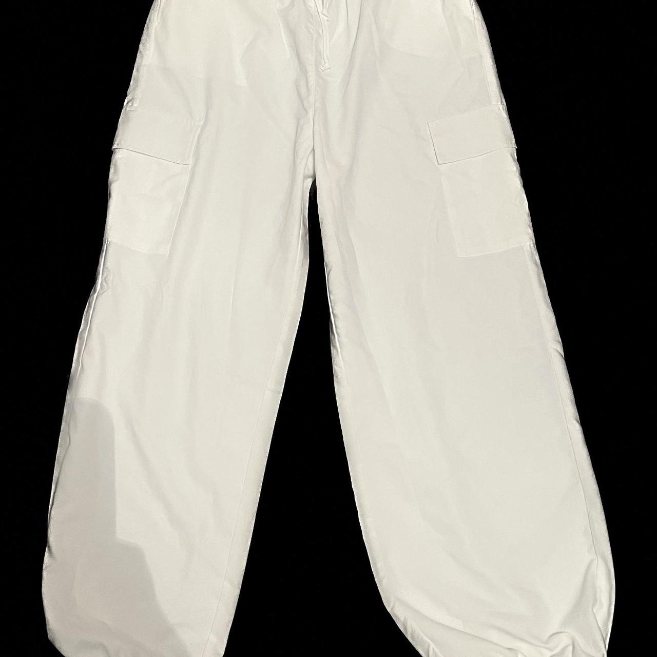 White Parachute pants would fit size 10,12 - Depop