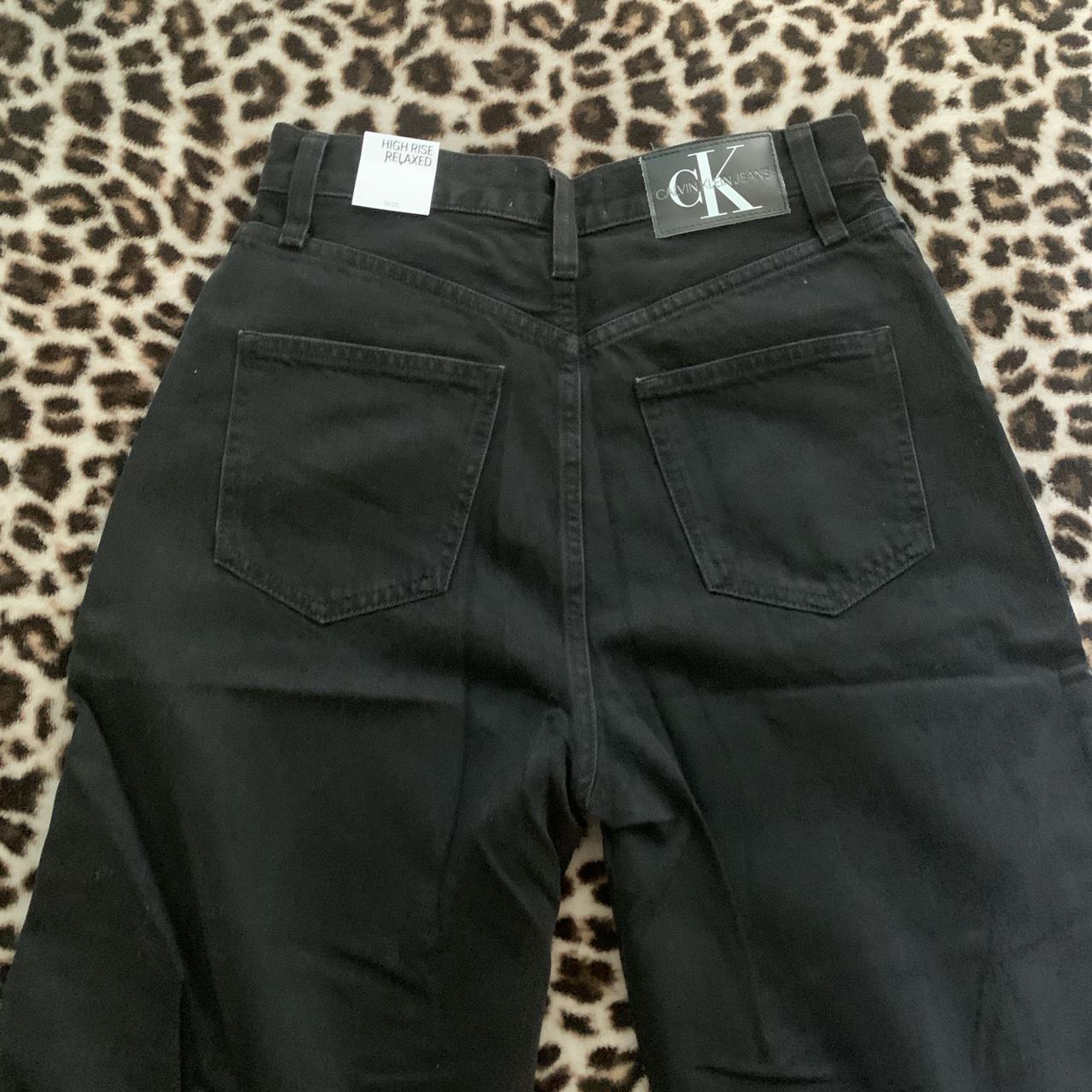Calvin Klein high rise relaxed fit black jeans... - Depop
