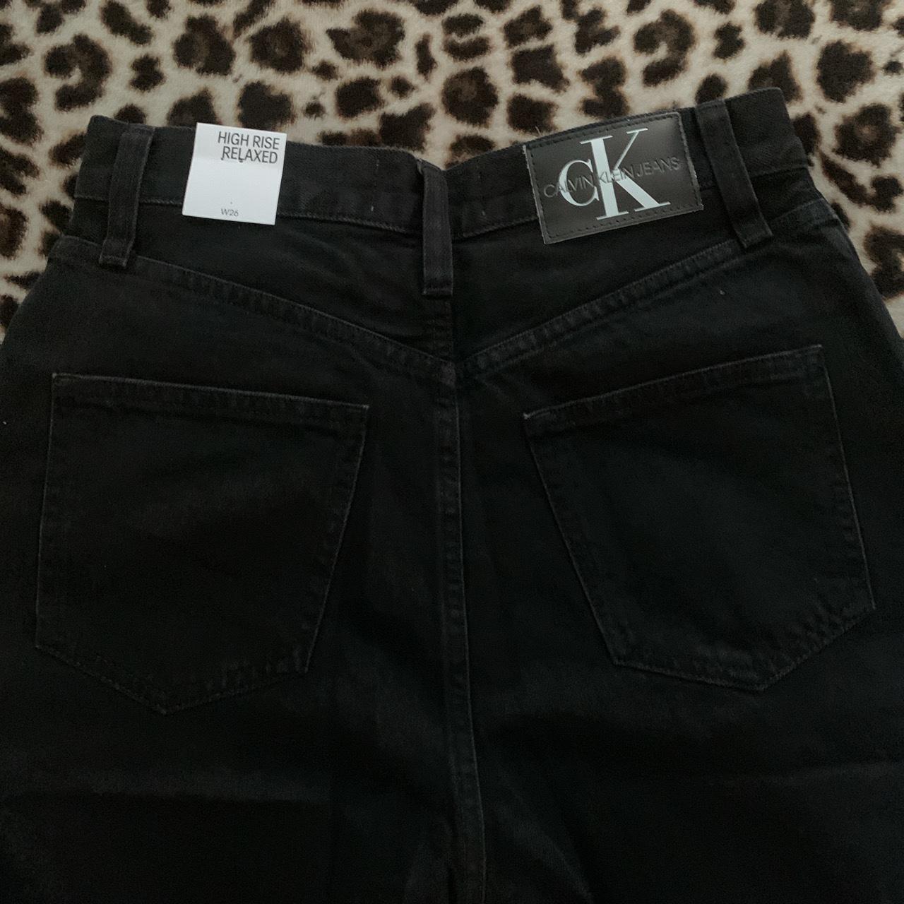 Calvin Klein high rise relaxed fit black jeans... - Depop