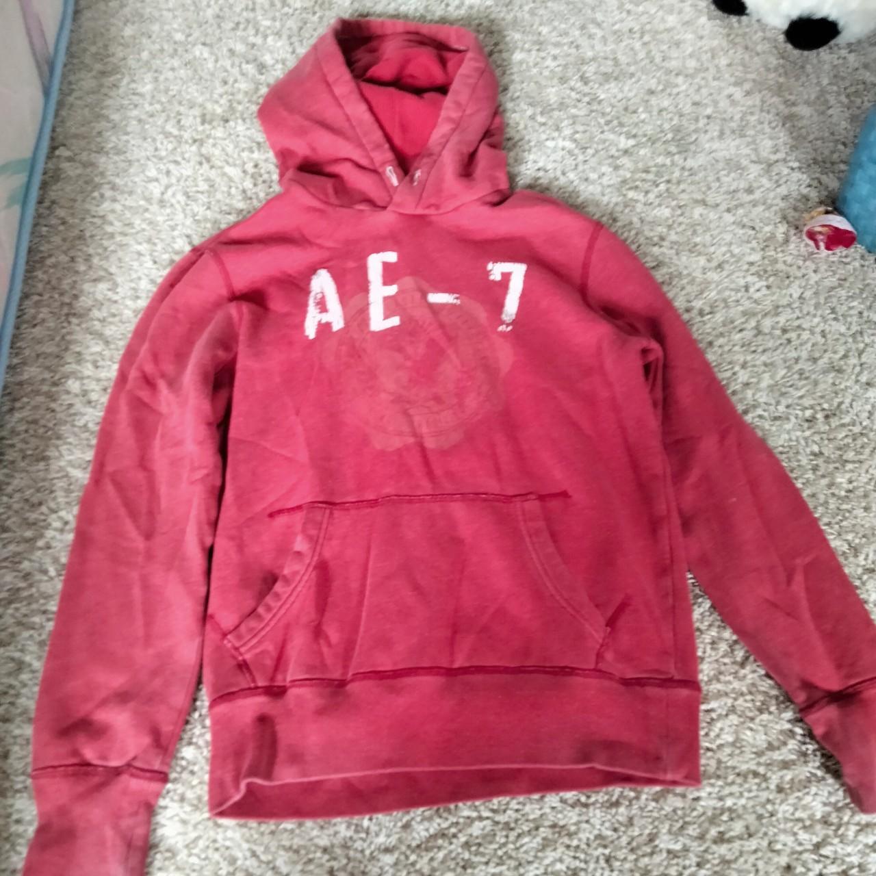 American Eagle hoodie, red with washed finish, size... - Depop