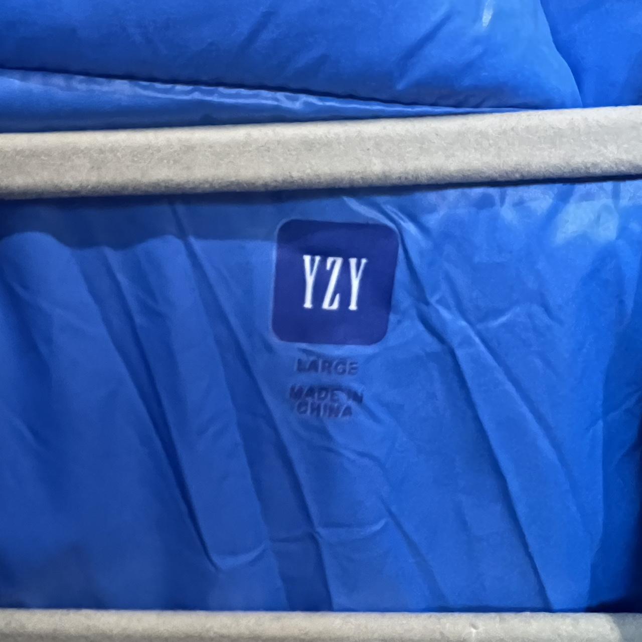 YEEZY GAP BLUE PUFFER SIZE IS LARGE CONDITION 9/10... - Depop