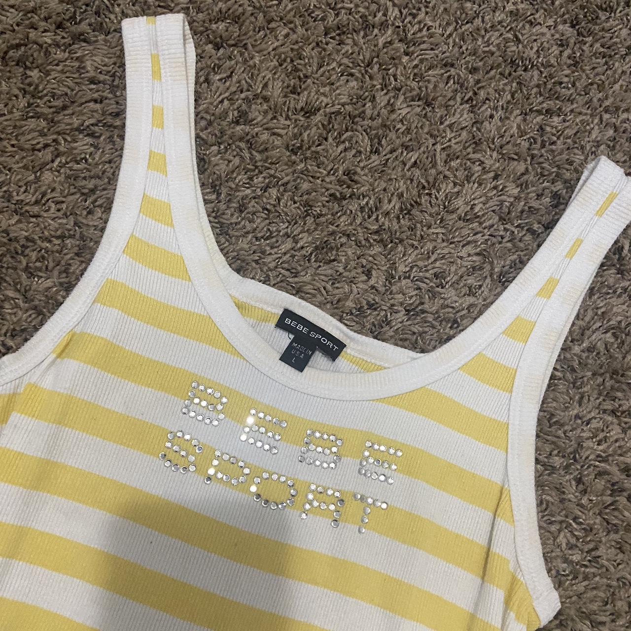 White and yellow stripped bebe tank size large but... - Depop
