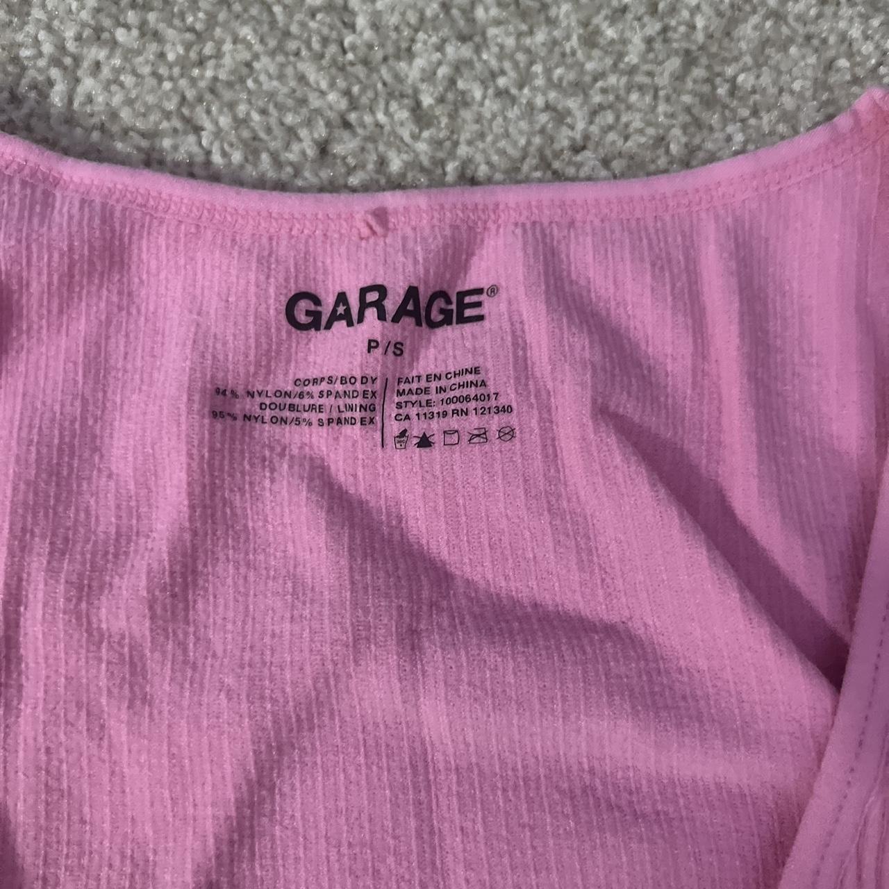 Pink garage tank top size small - Depop