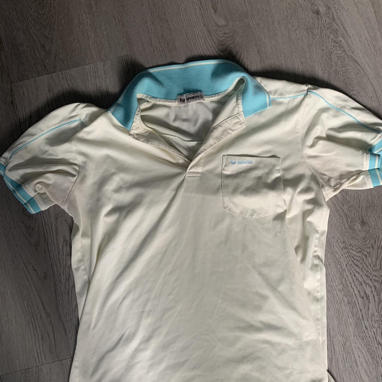 cream and blue polo shirt vintage from the... - Depop