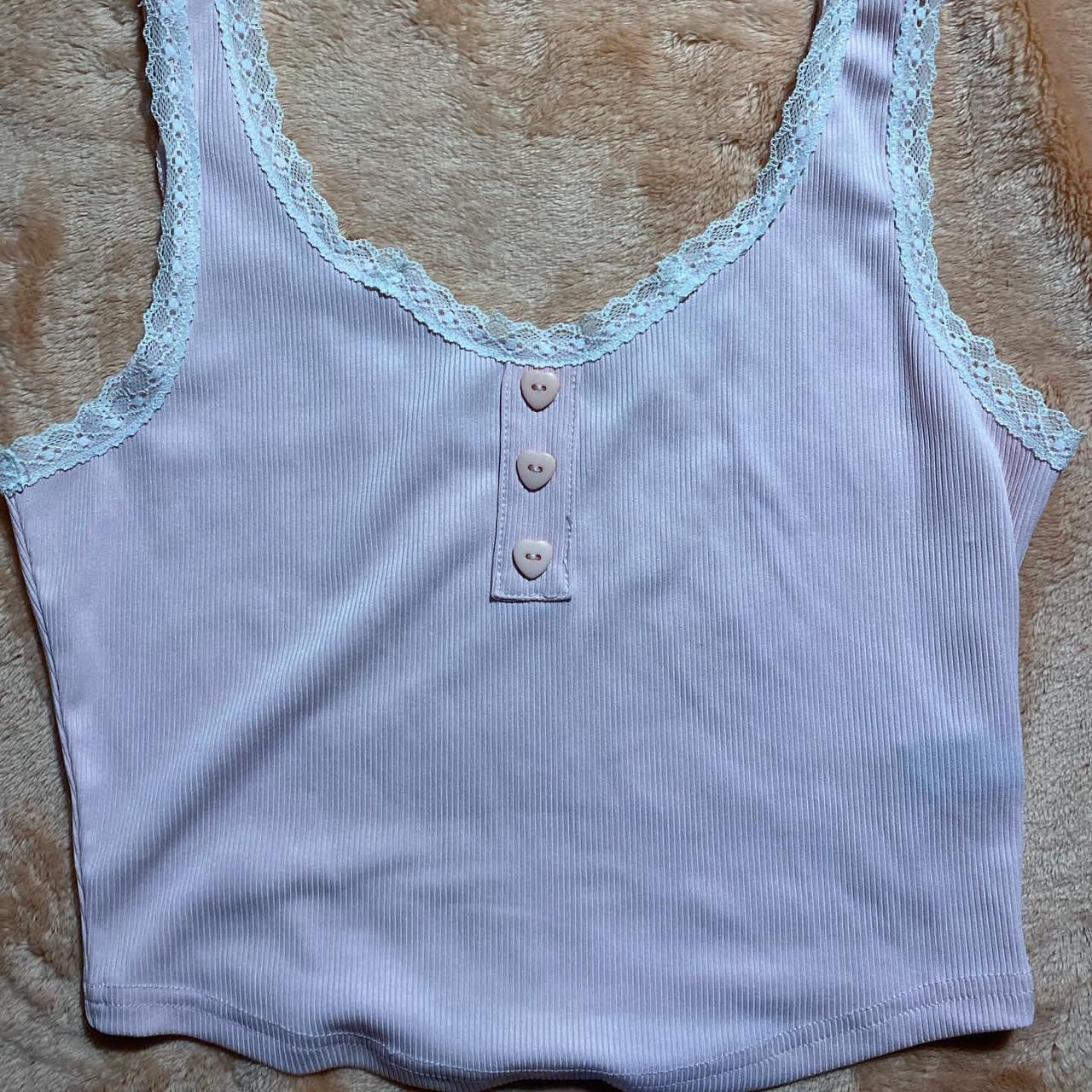 ROMWE pink tank top with white lace and heart buttons - Depop