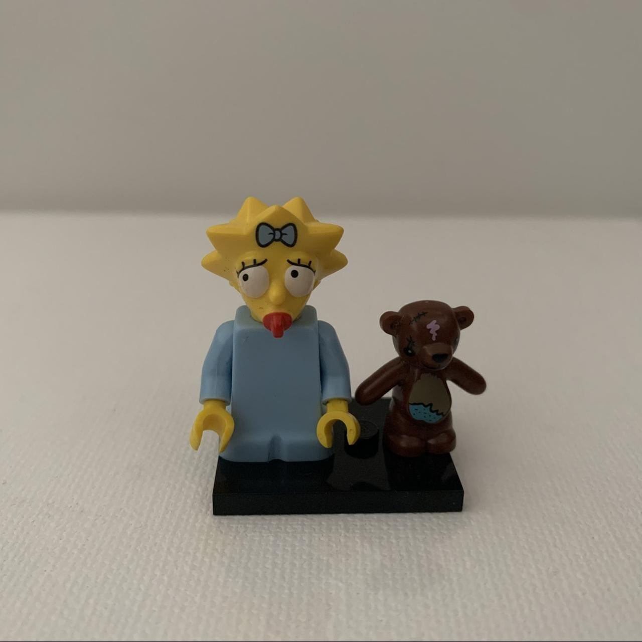 Maggie Simpson lego mini figure, comes with stand... - Depop