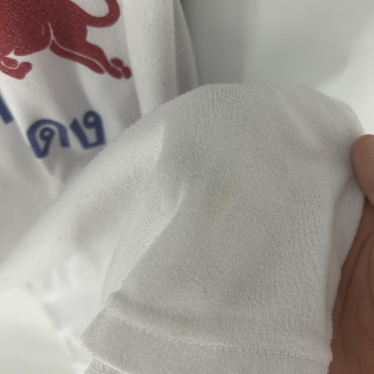 Vintage Thai Red Bull tank top Stains shown in... - Depop