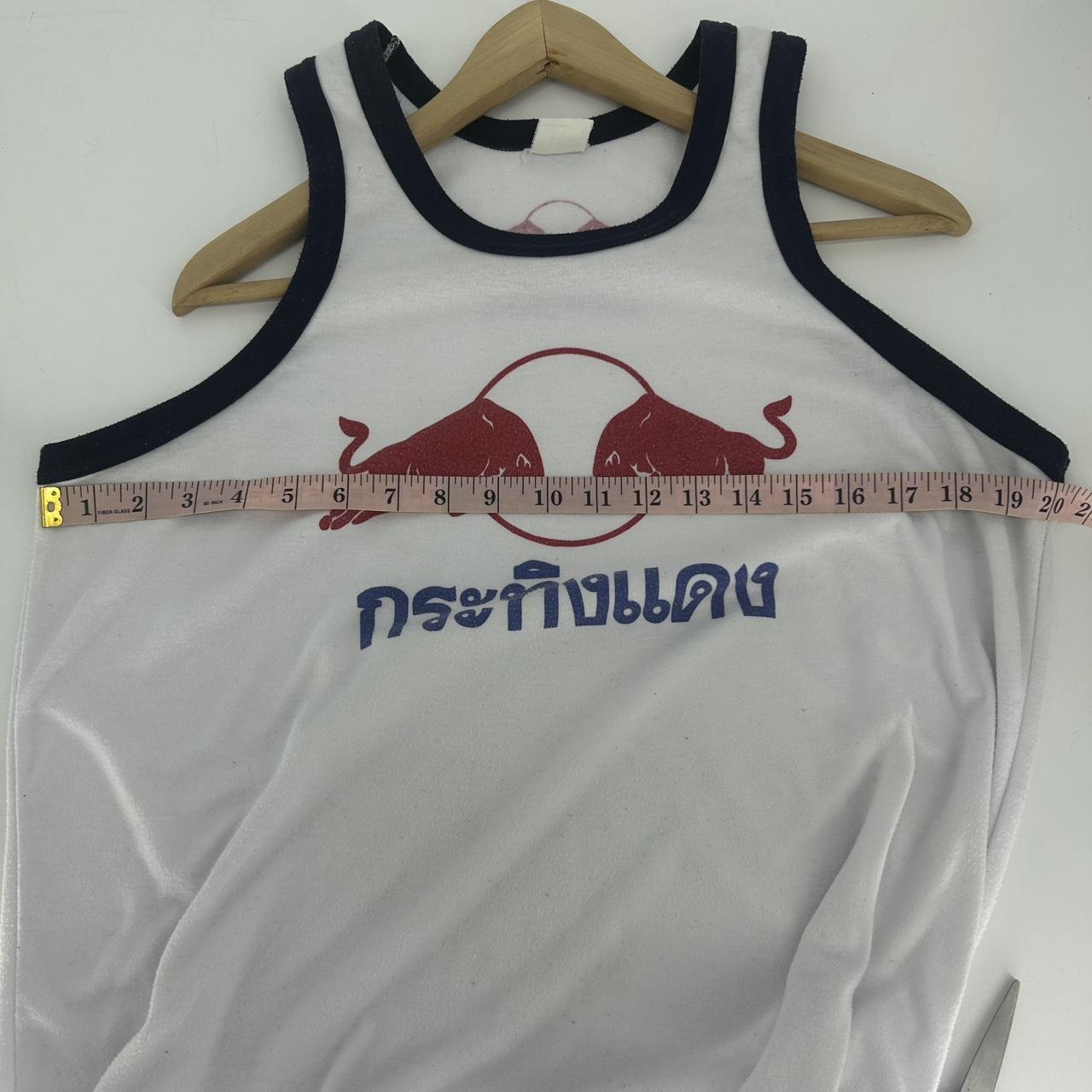 Vintage Thai Red Bull tank top Stains shown in... - Depop