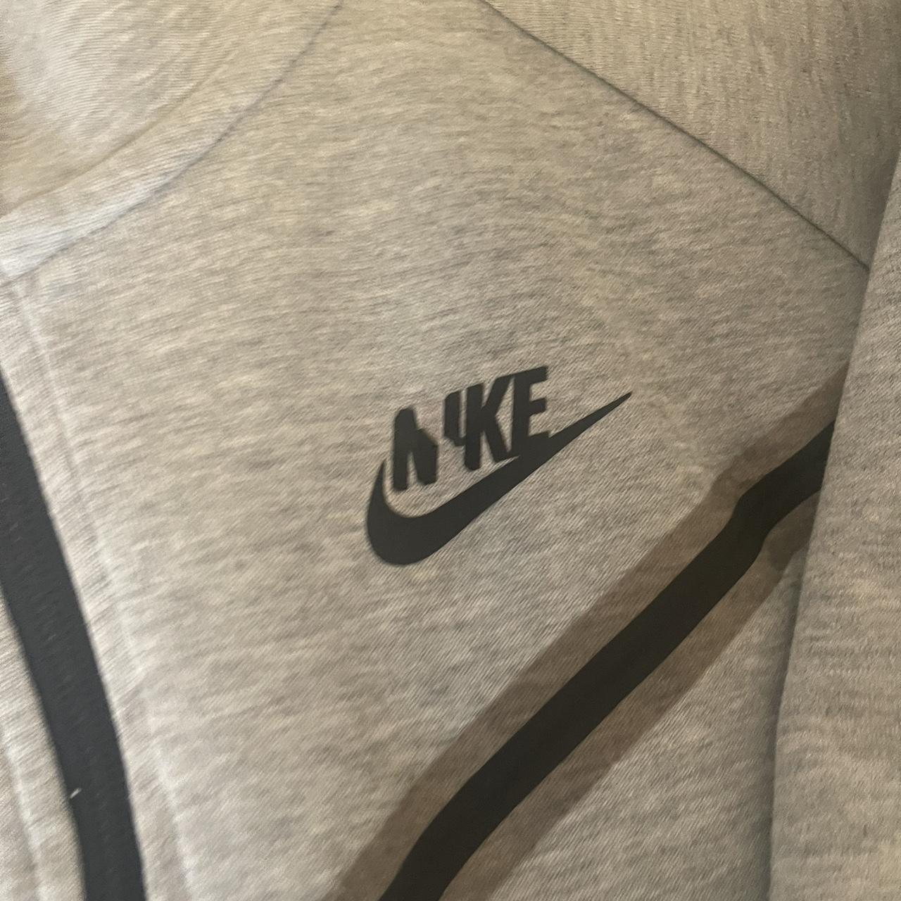 woman’s nike tech fleece writing is peeling slightly... - Depop