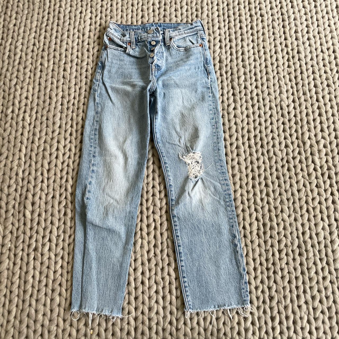 distressed light wash levi jeans - Depop