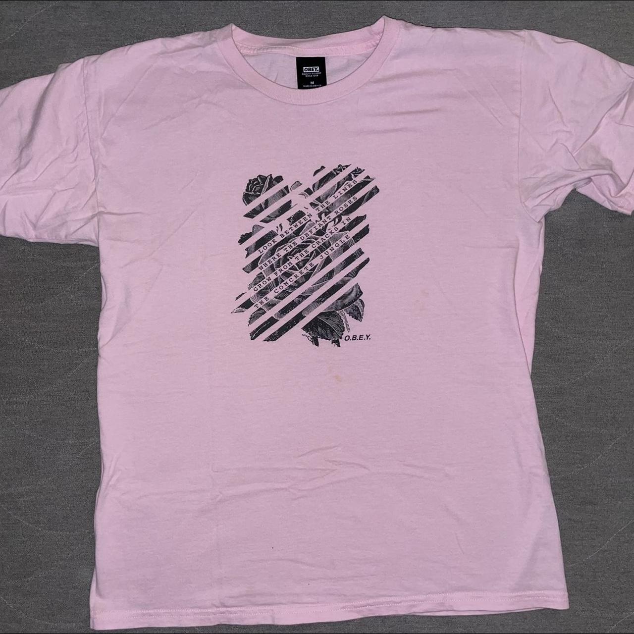 Pink Obey shirt. Light stain below and left of image... - Depop