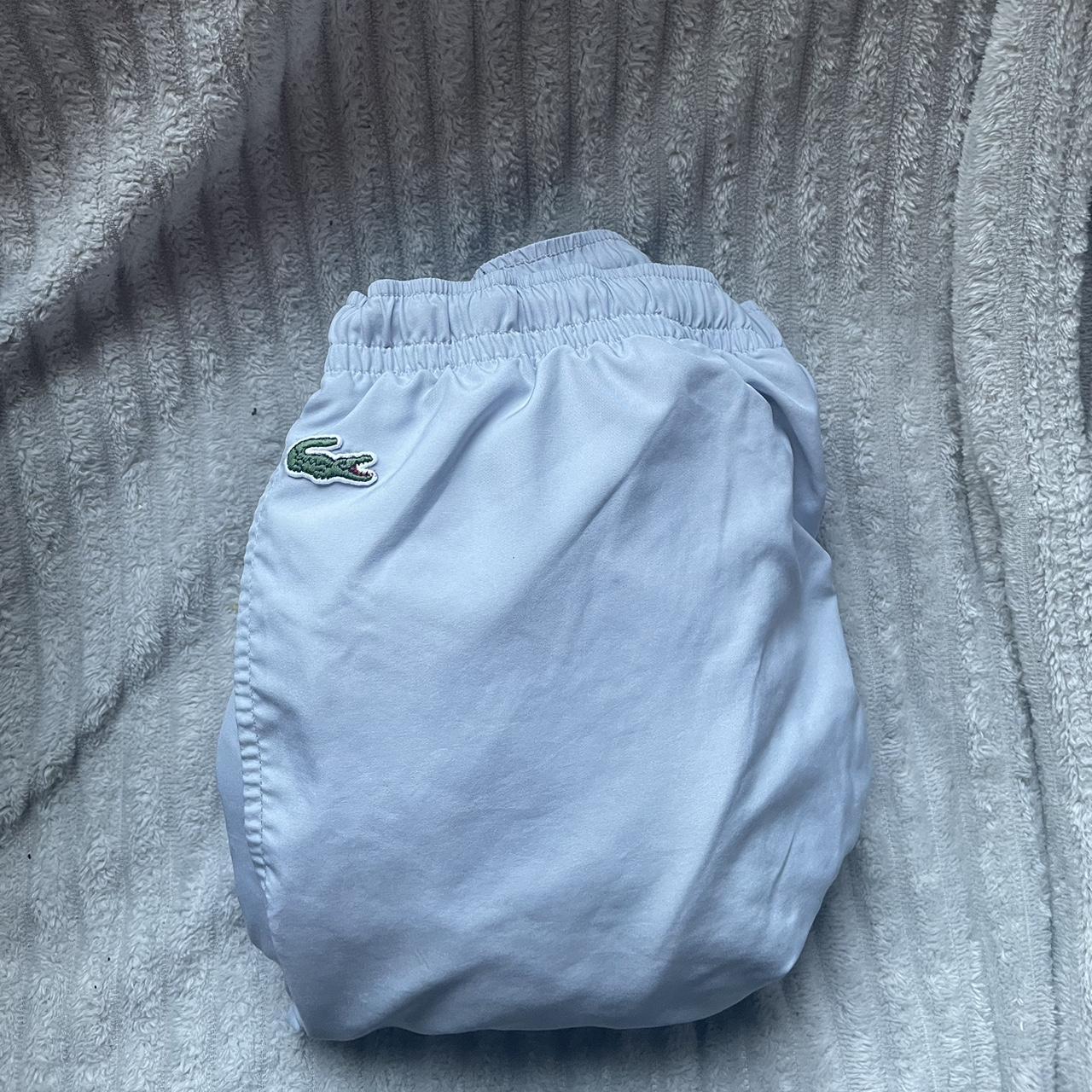 Baby Blue Lacoste tracksuit bottons Size large - Depop