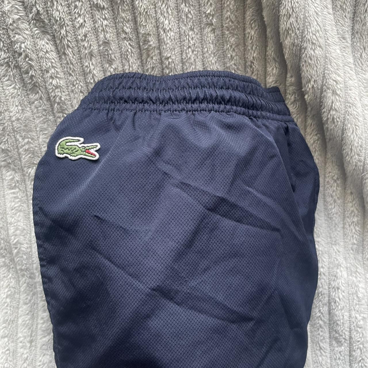 Navy lacoste bottoms Small rip on back hence... - Depop