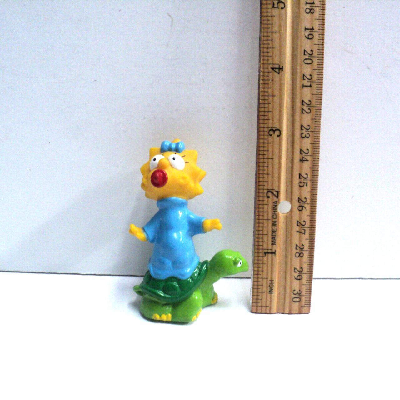Maggie Simpson Standing on a Turtle Figurine Plastic... - Depop