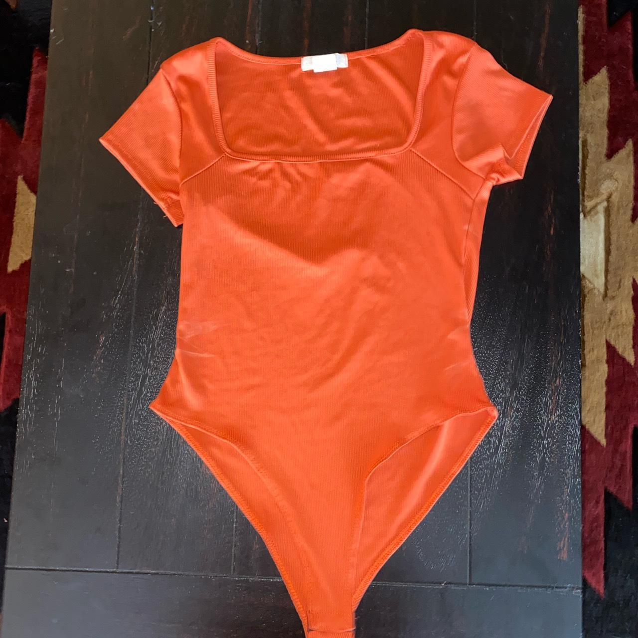 Orange low bodysuit Size medium - Depop