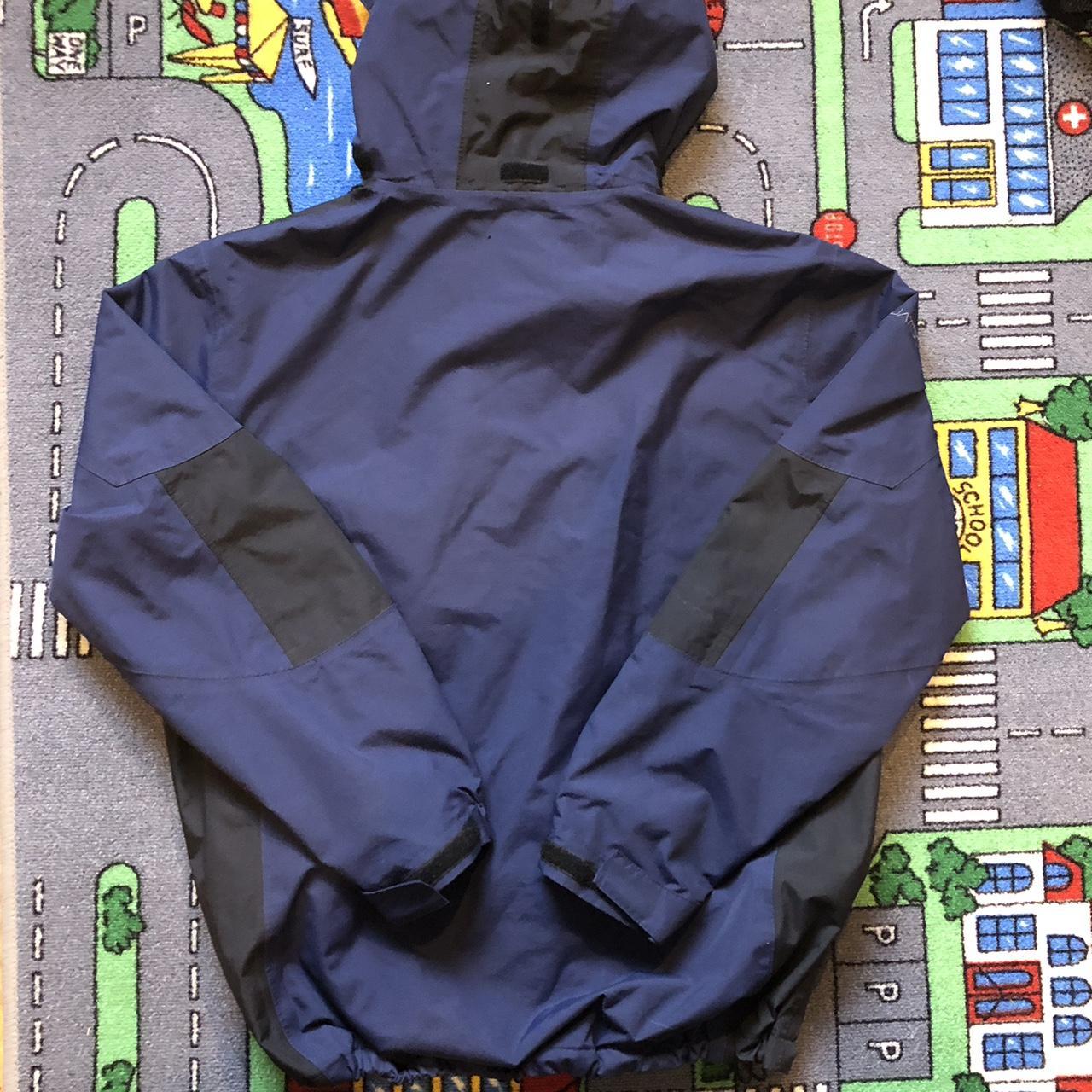 Gortex black and navy blue panelled jacket with... - Depop