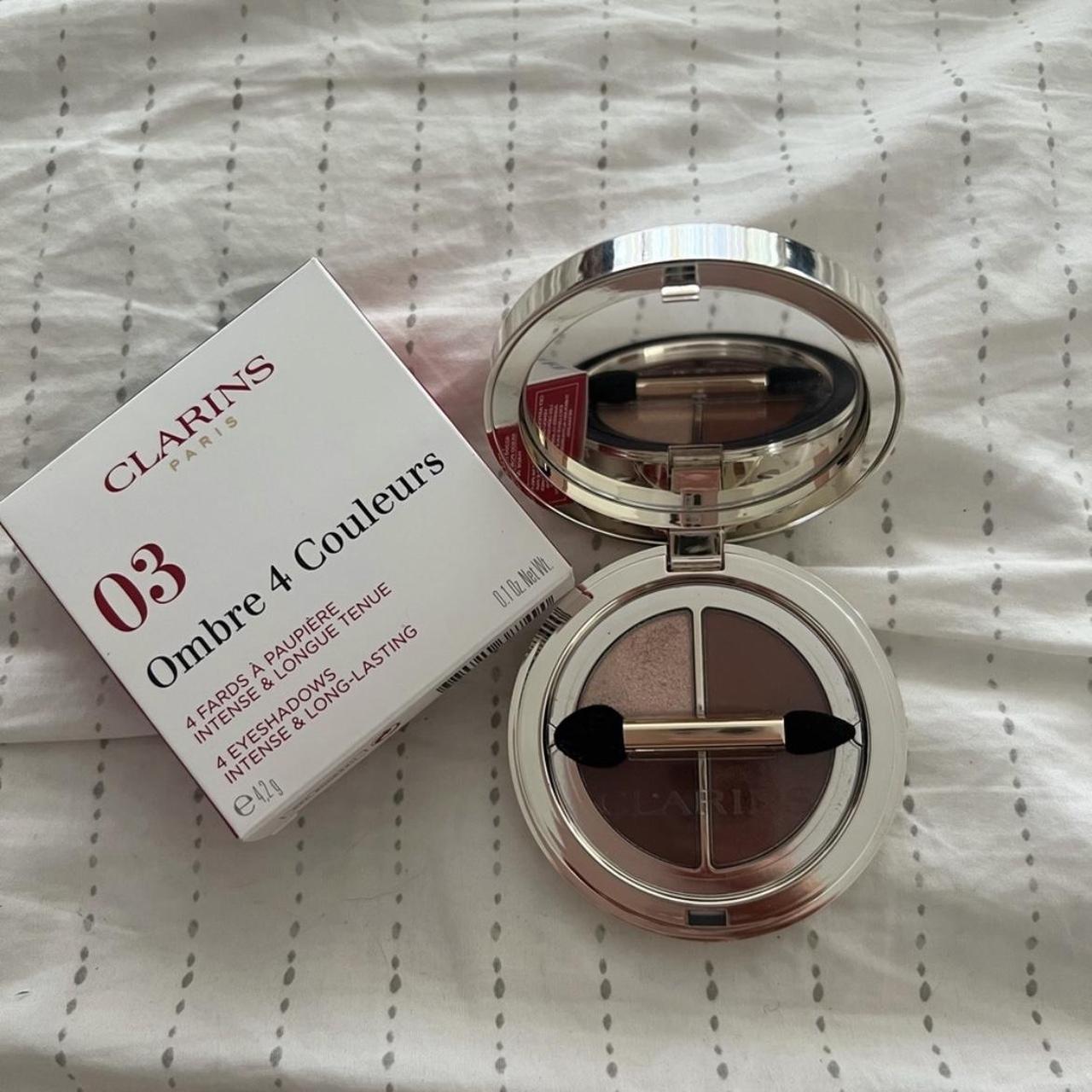 Clarins eye shadow palette with 4 colors. Used it a... - Depop