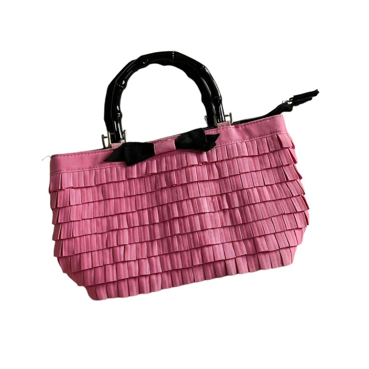 Pink ruffle “bamboo” handle bag with black bow.... - Depop