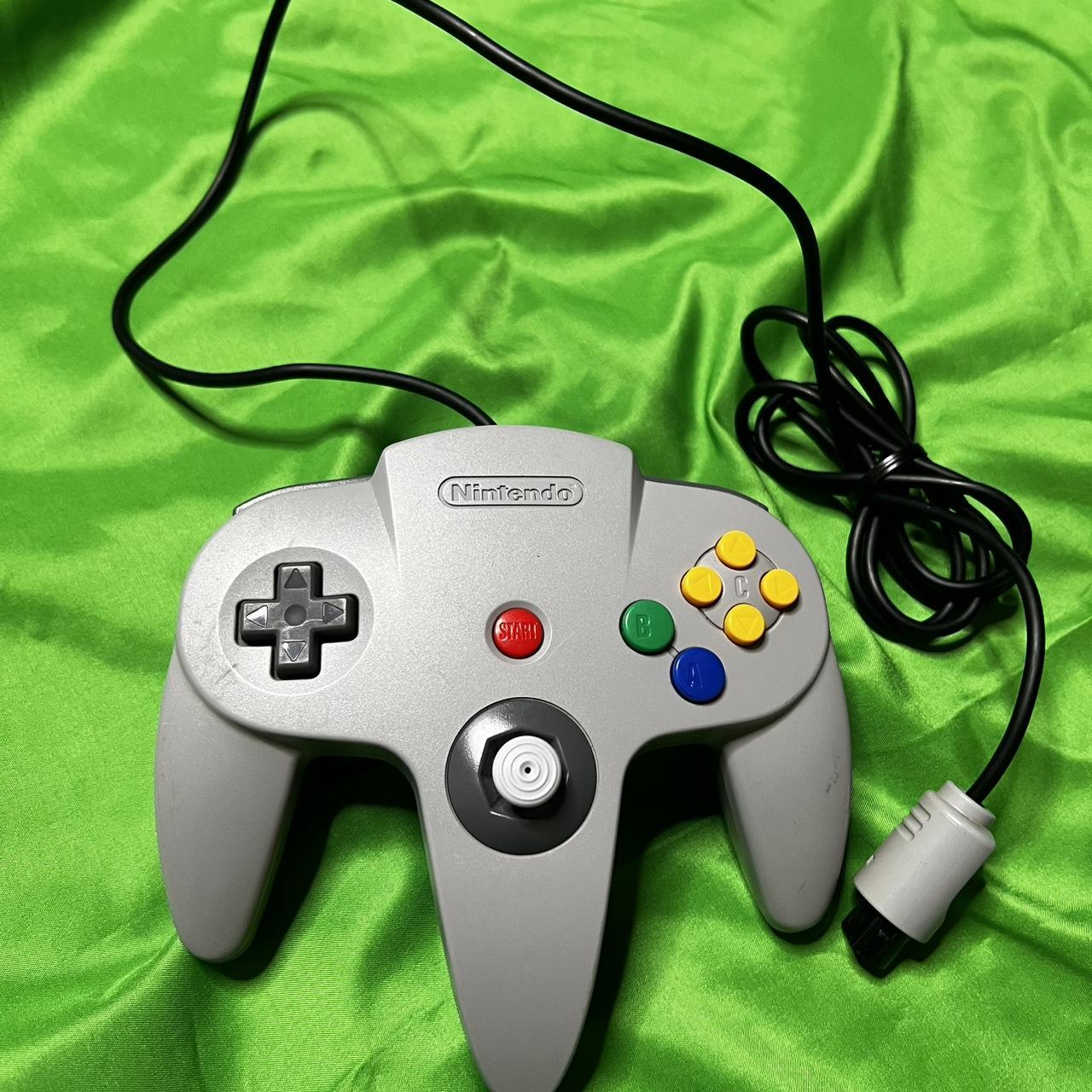 Grey Nintendo 64 controller with a few scratches... - Depop
