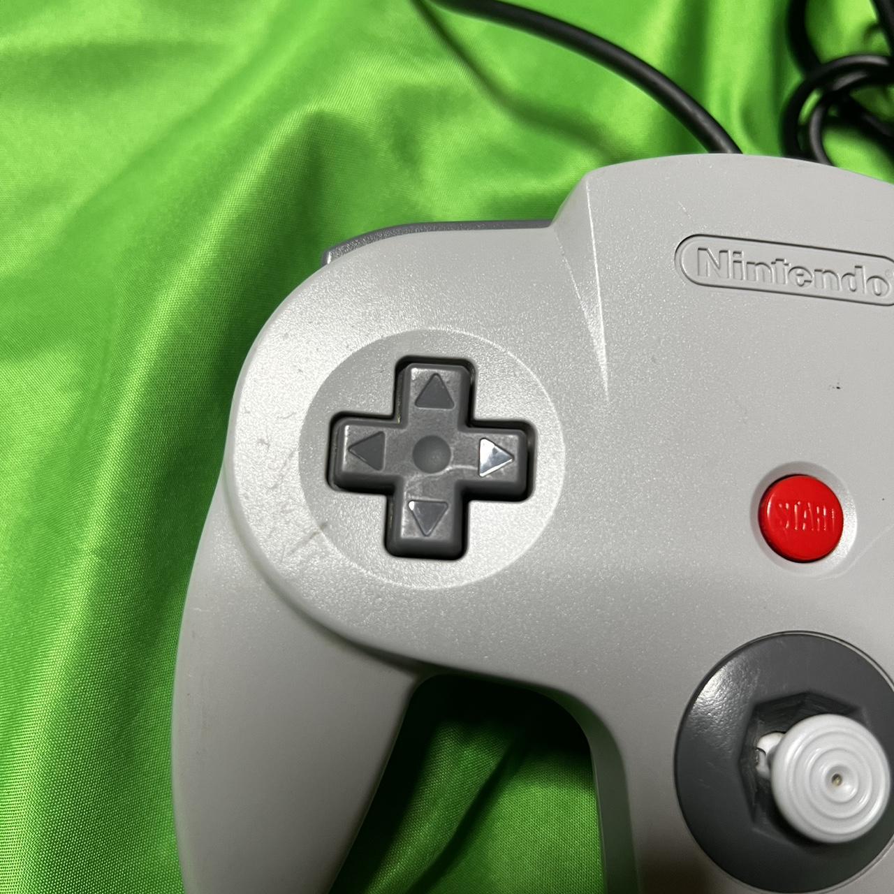 Grey Nintendo 64 controller with a few scratches... - Depop