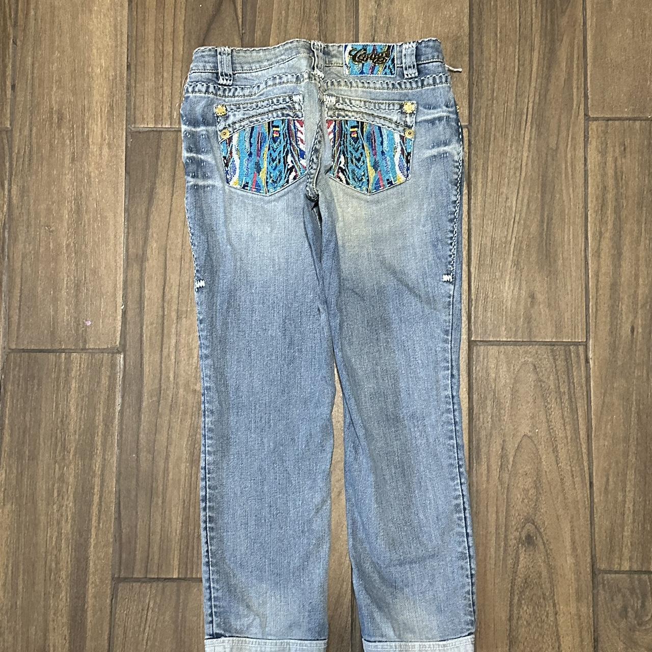 Coogi women’s distressed bootcut embroidered golden... - Depop