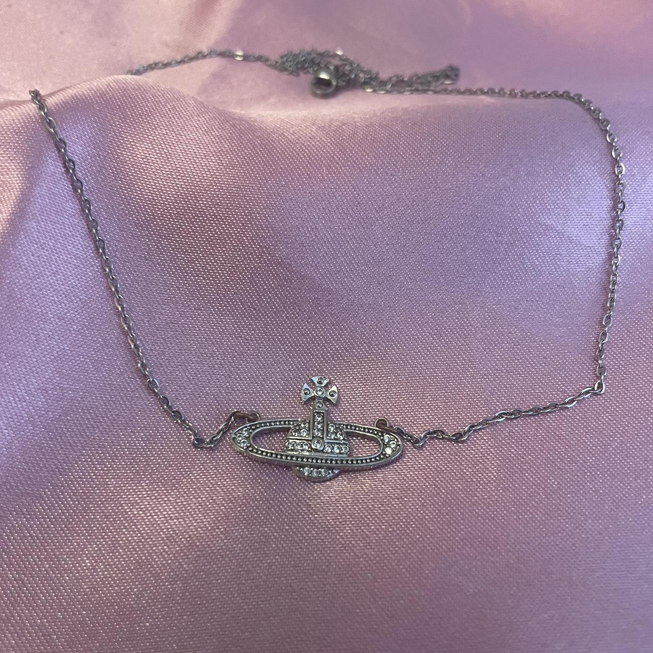 silver planet necklace bought from a diy pop up... - Depop