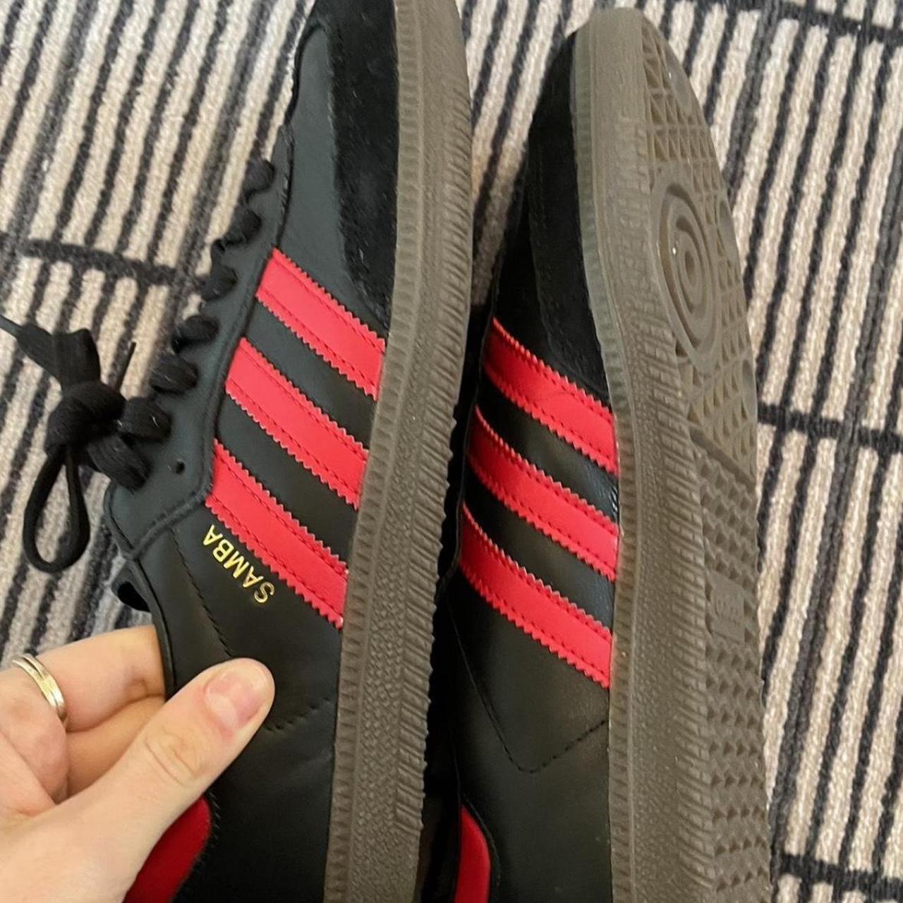 Red and black Manchester United Adidas Sambas. Size... - Depop