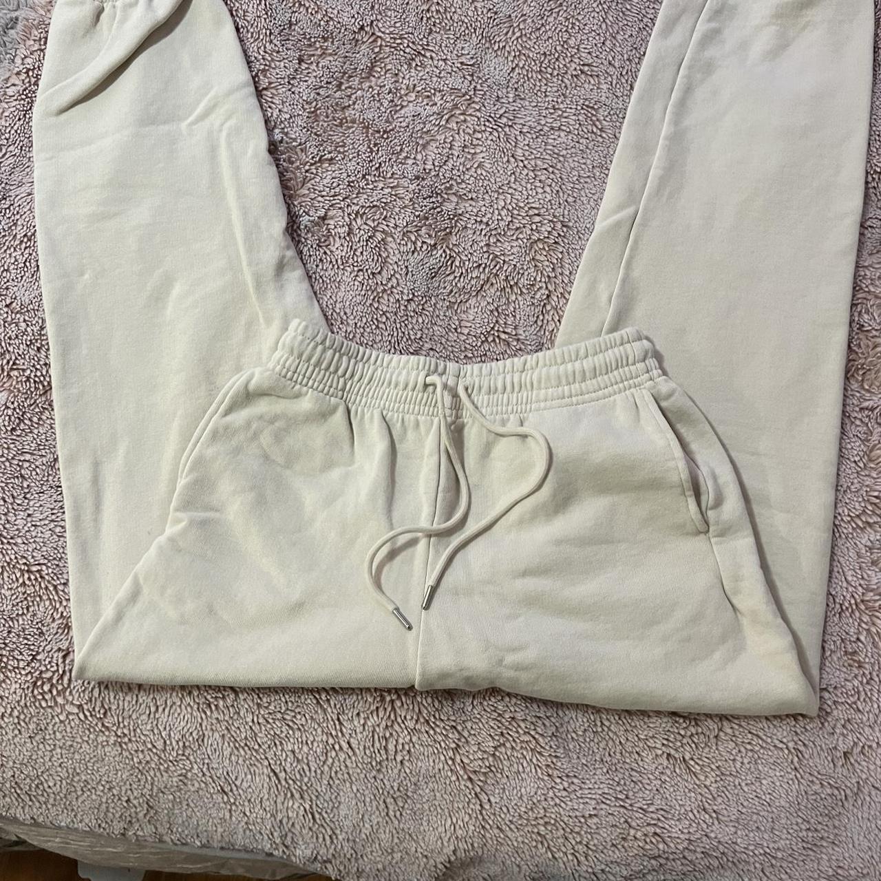 Uniqlo cream sweatpants. minor stains can be seen in... - Depop