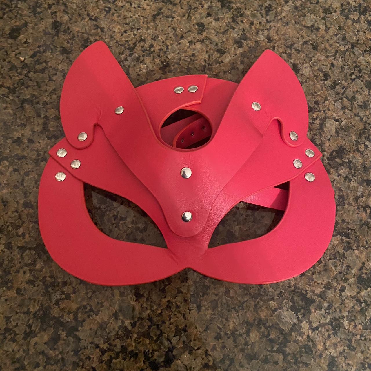 Red leather cat mask with silver studs. The strap is... - Depop