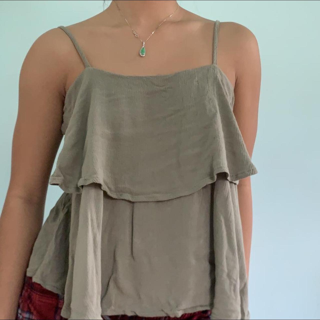 Green ruffle top 💚 Would look great with white... - Depop