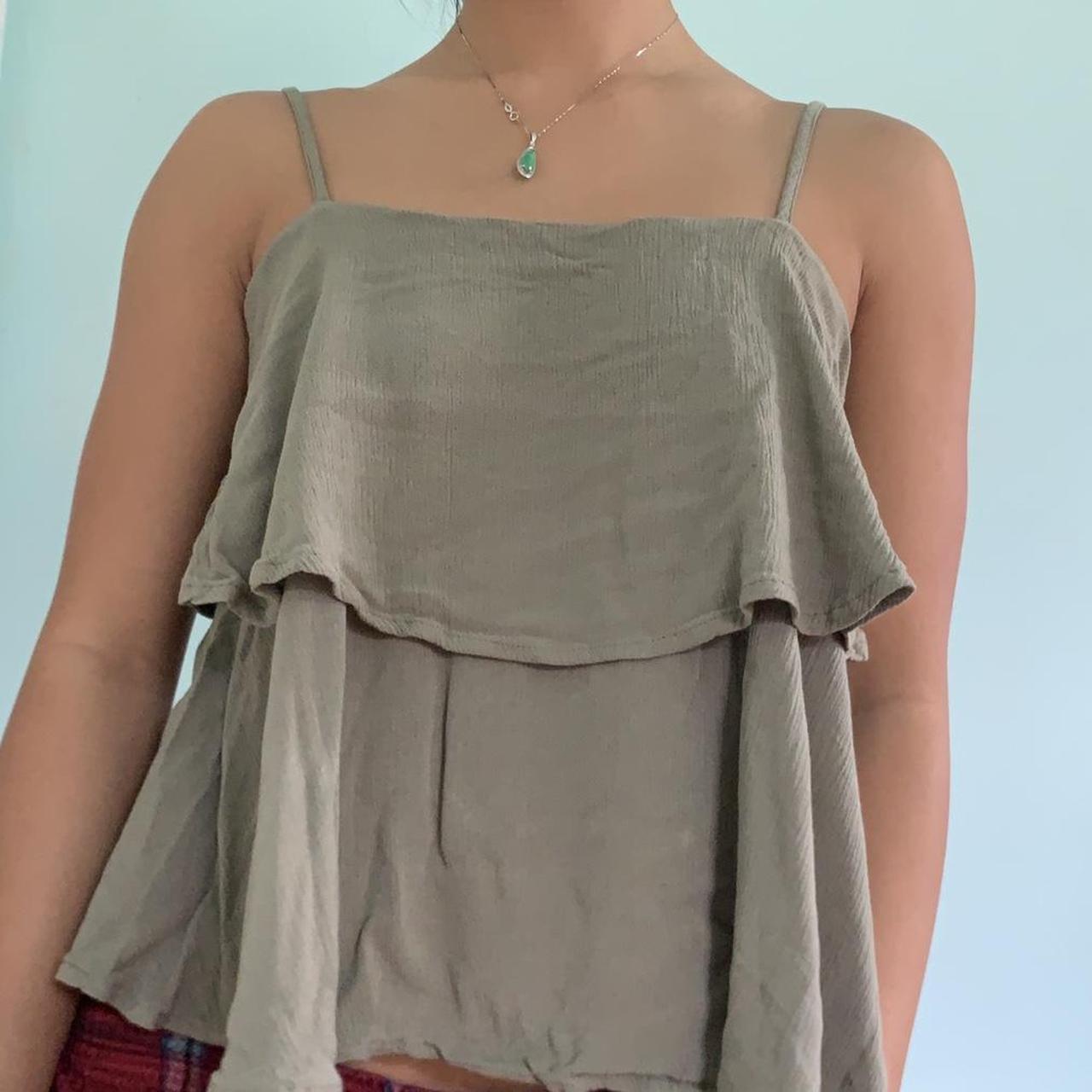 Green ruffle top 💚 Would look great with white... - Depop