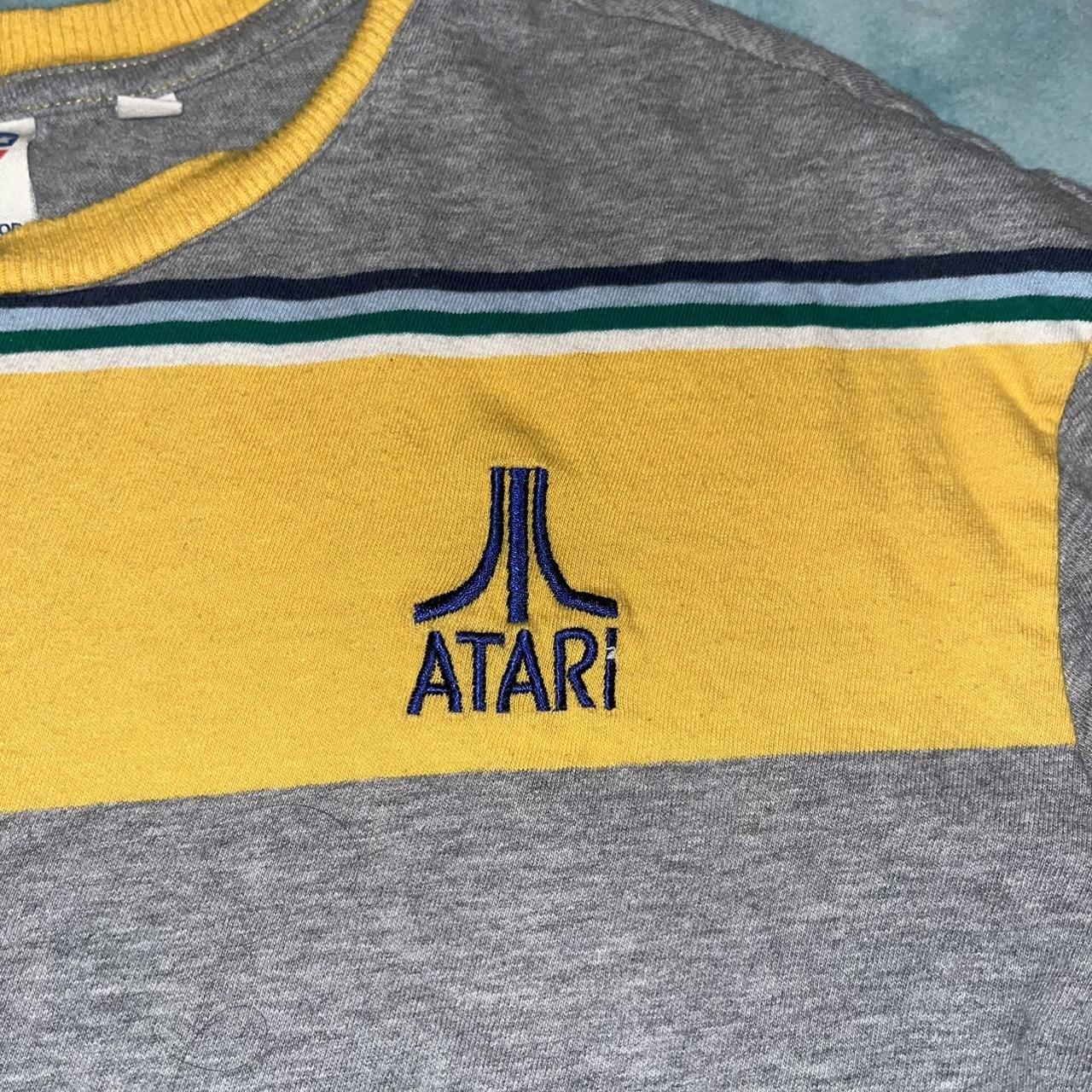 Junk Food Clothing Atari Stripped Shirt Size... - Depop