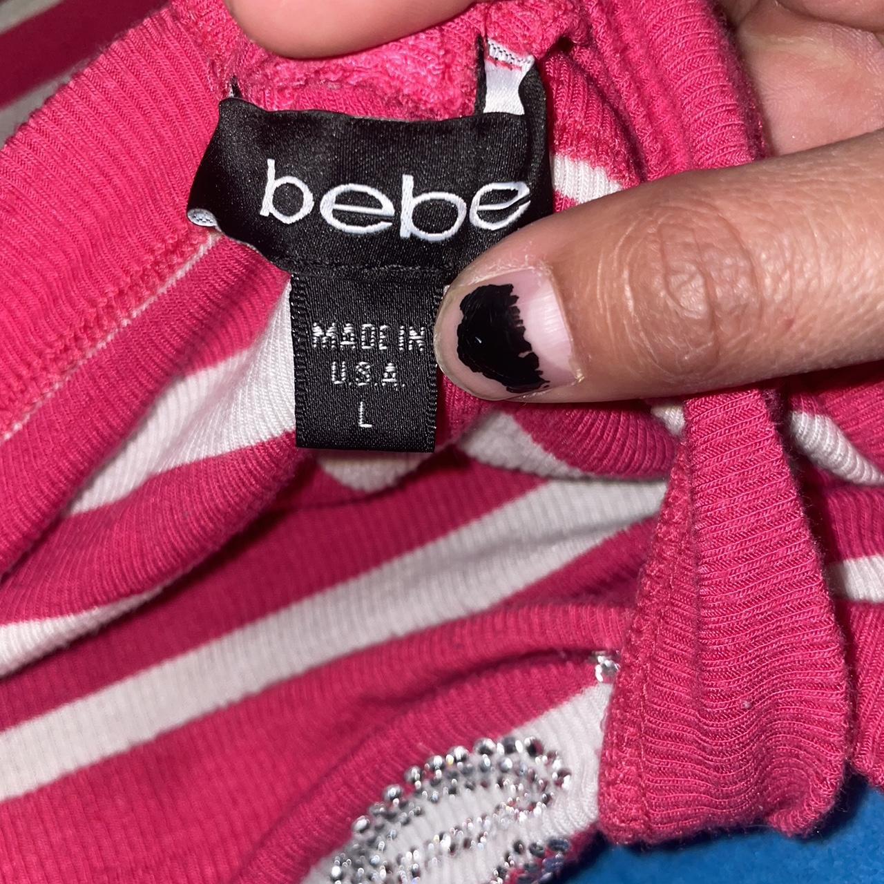 Pink and White BEBE tank top Size L used but in... - Depop