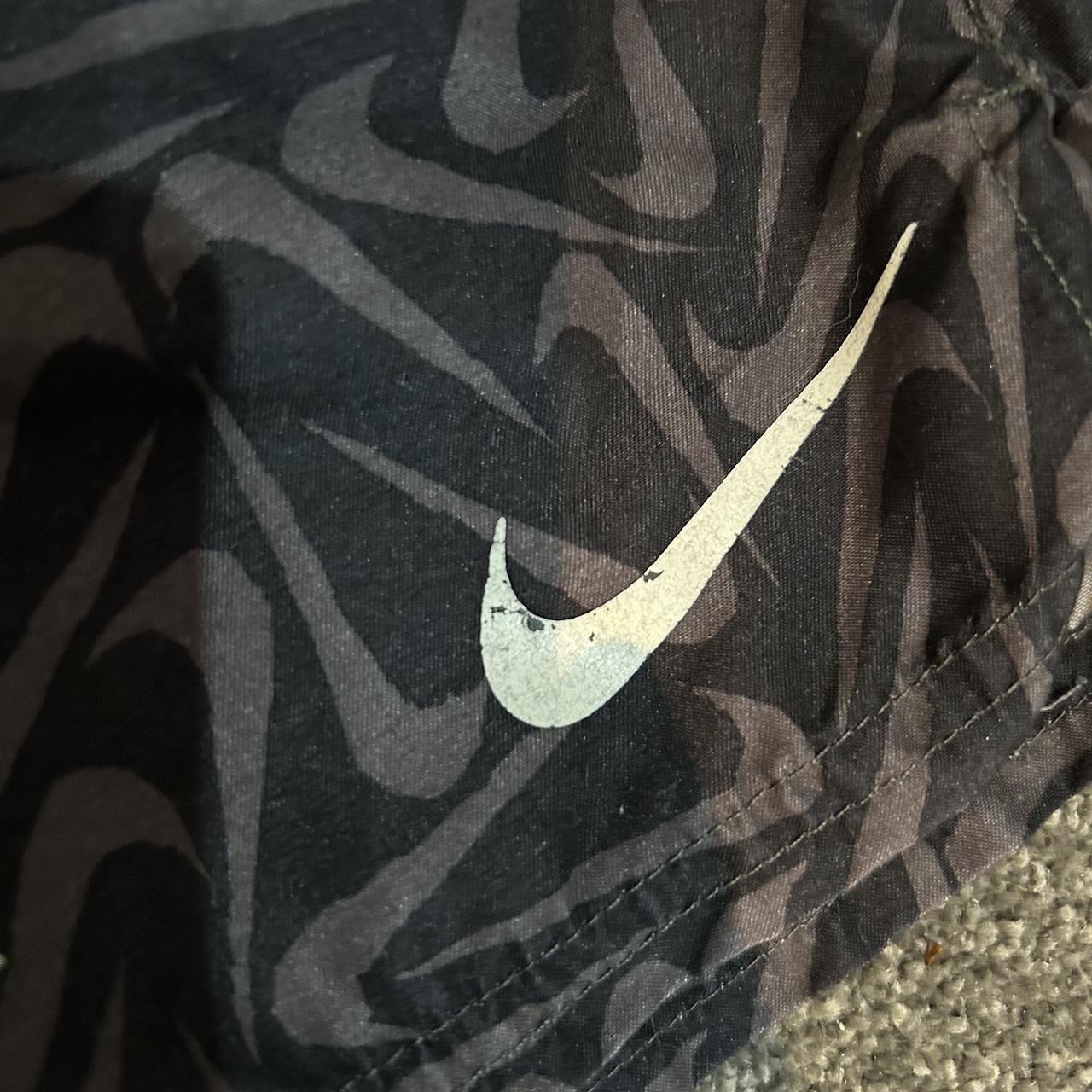 black nike pattern swimming shorts size Small mens... - Depop