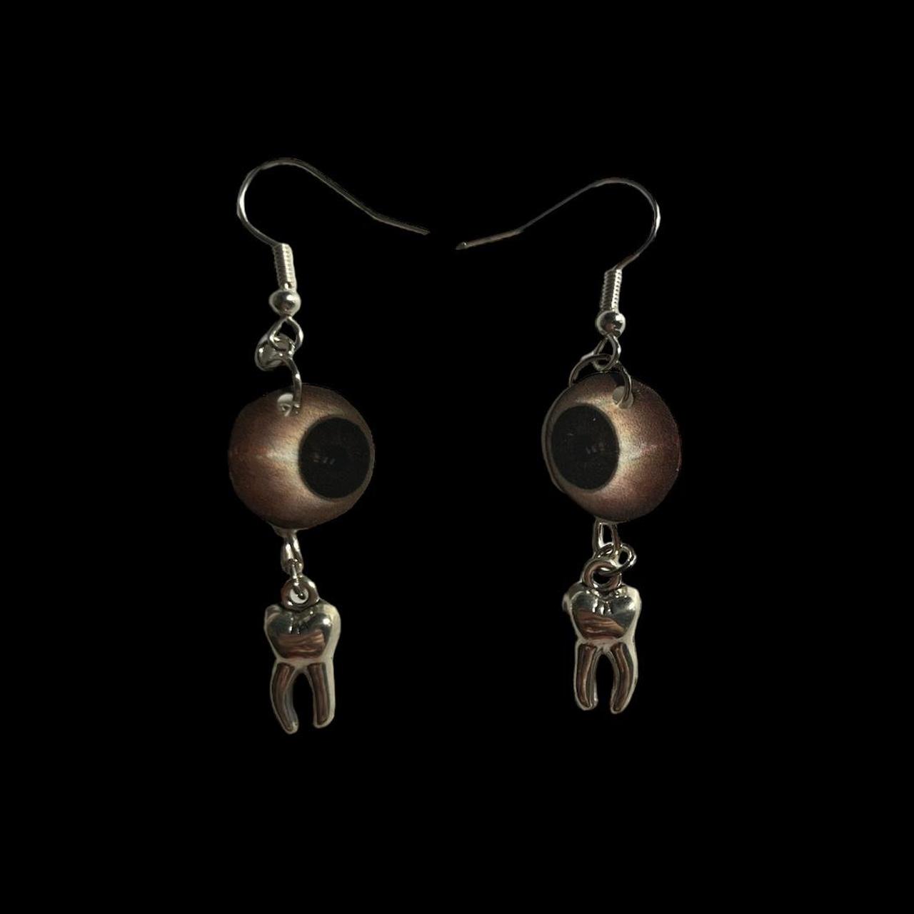 “brainless” creepy eye and tooth earring pair... - Depop